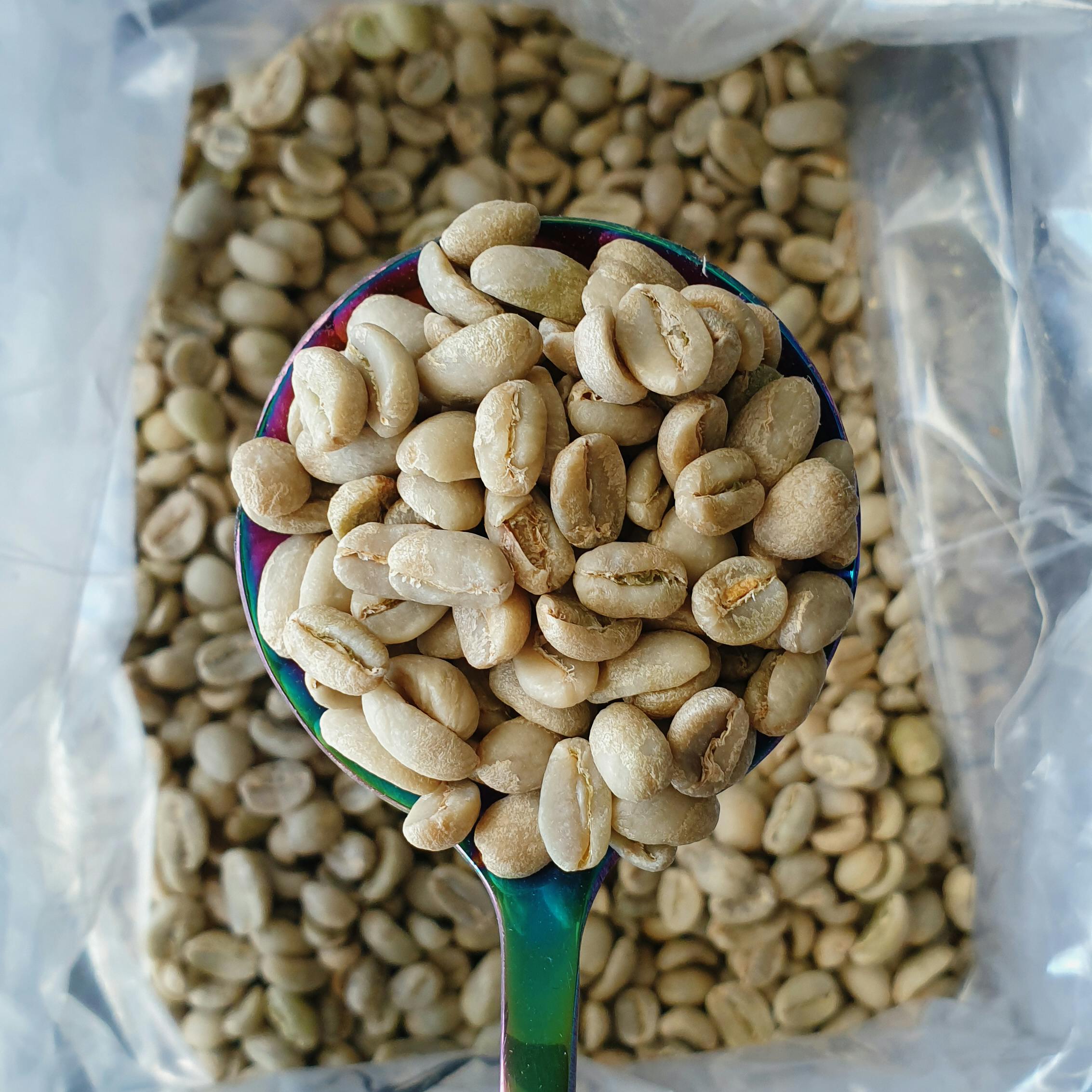 Spoonful of Coffee Beans · Free Stock Photo