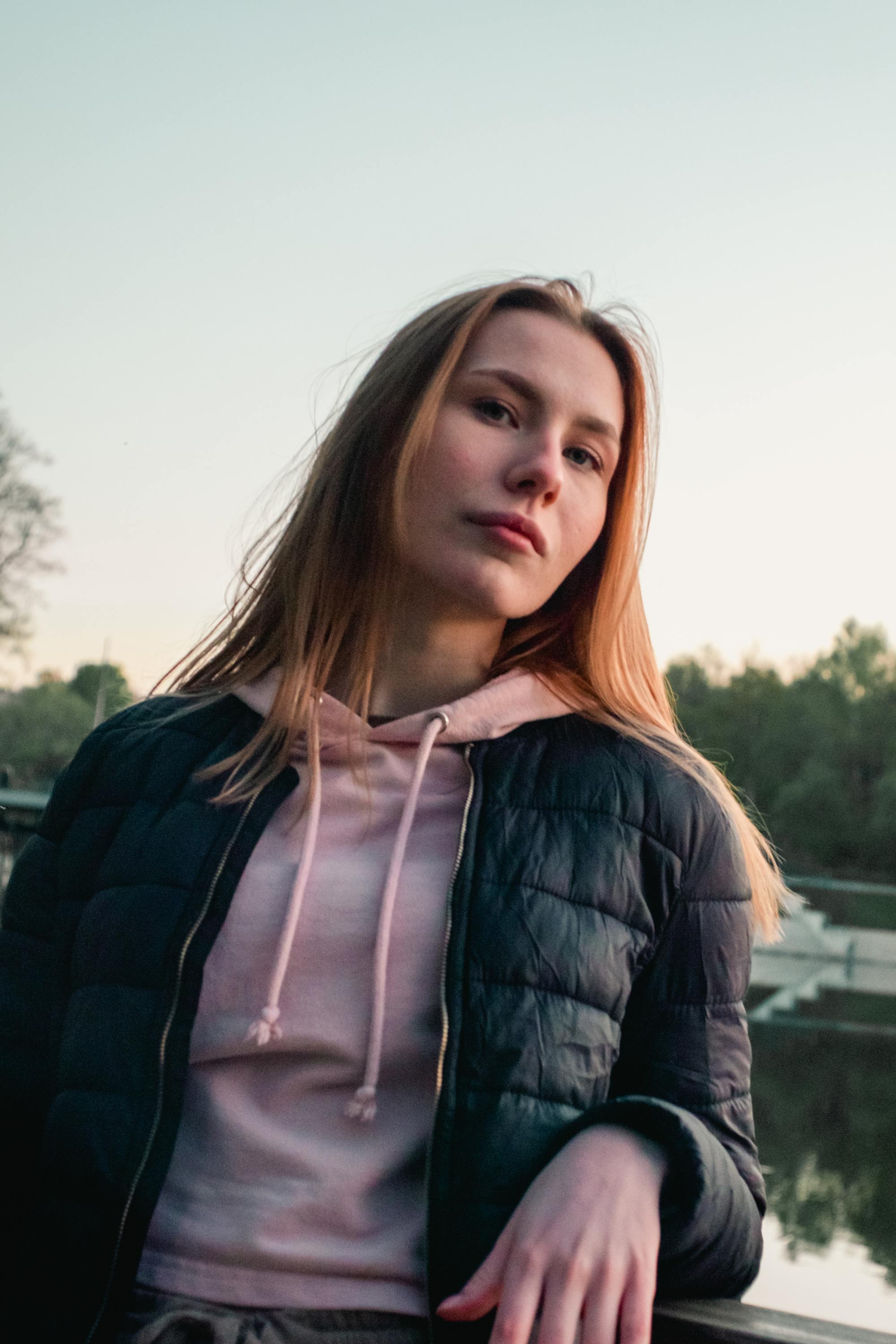 A Side View of a Woman in Black Jacket · Free Stock Photo