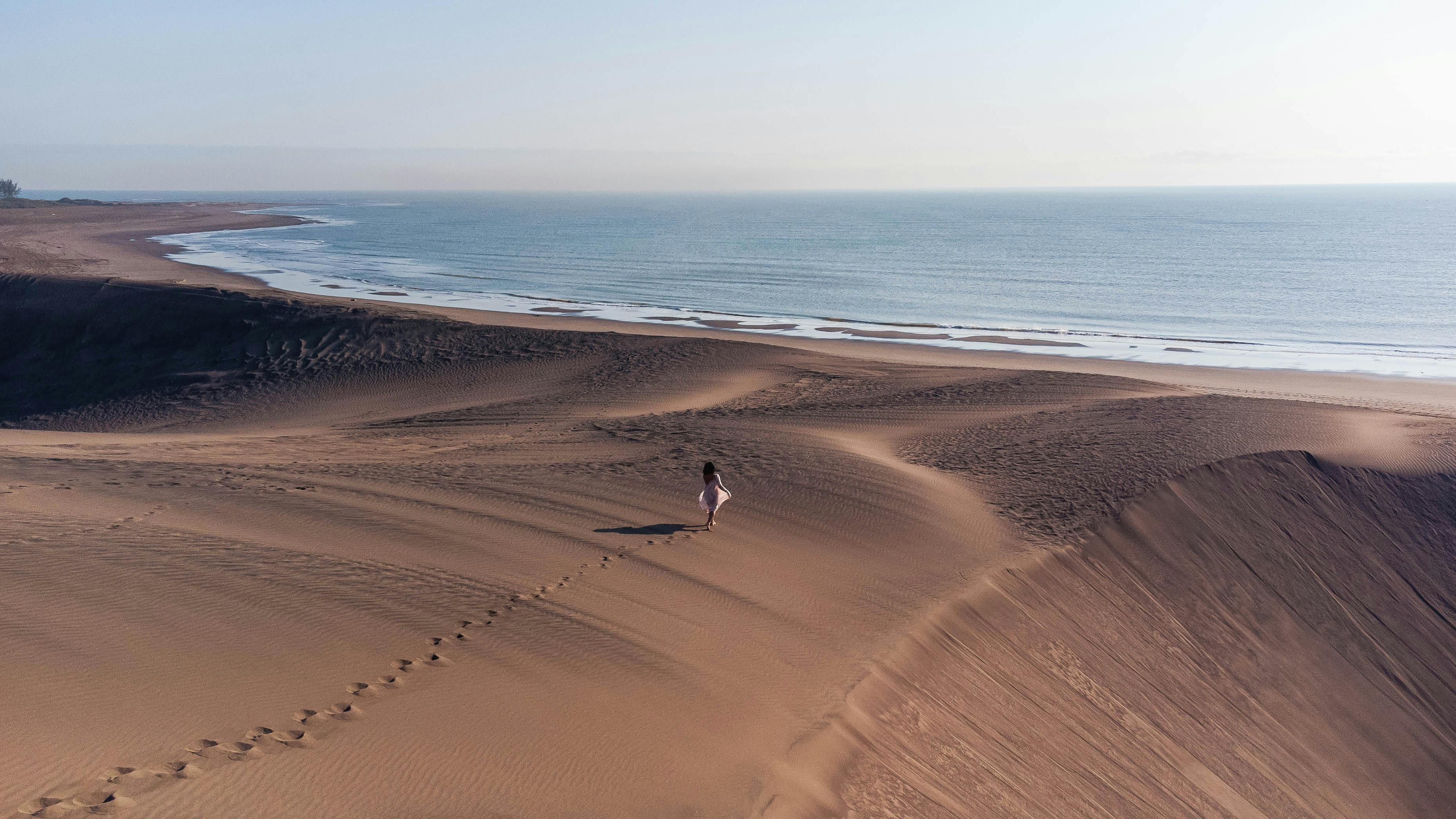 Woman Walking on the Sand in the Beach · Free Stock Photo