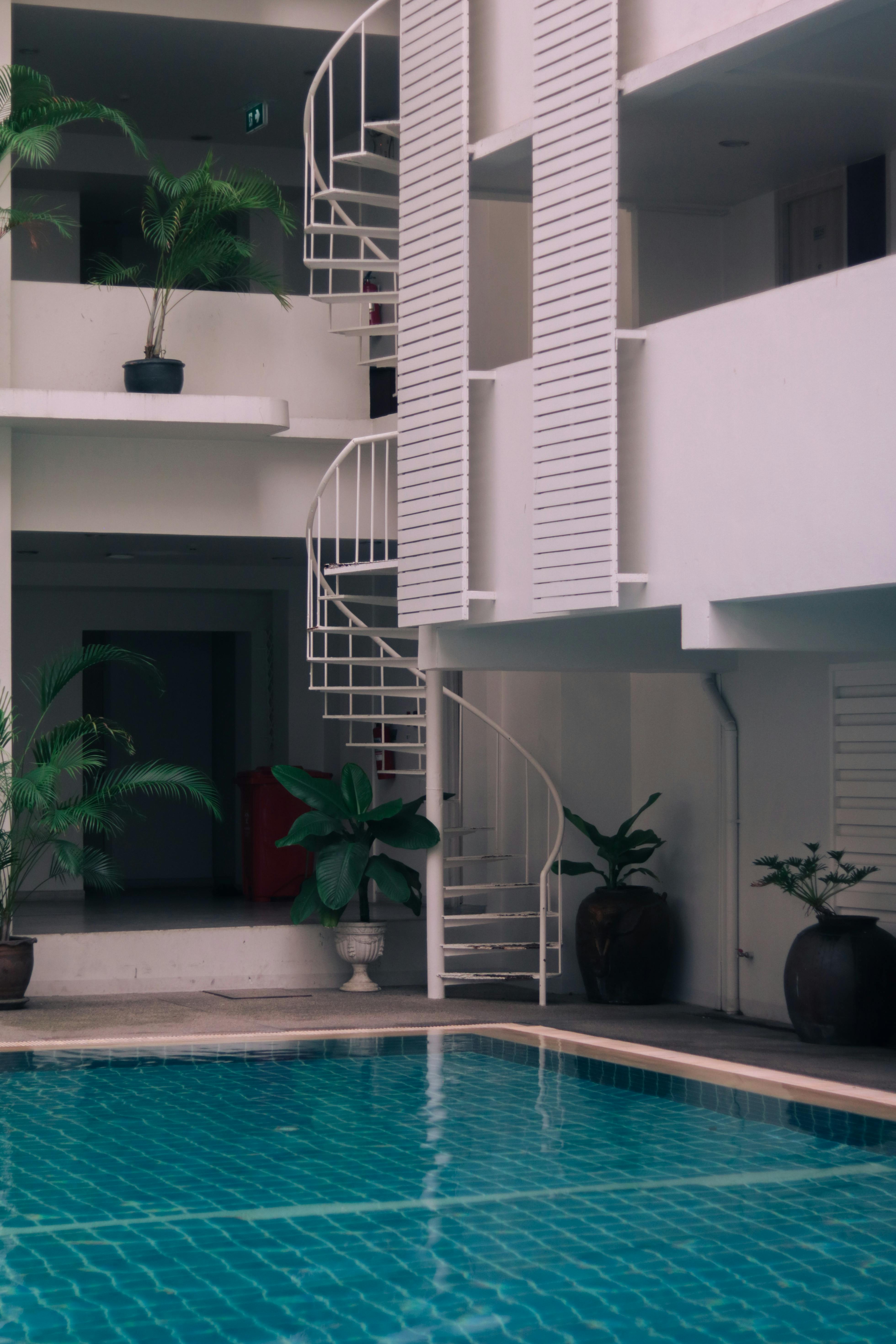 Spiral Staircase near the Swimming Pool · Free Stock Photo