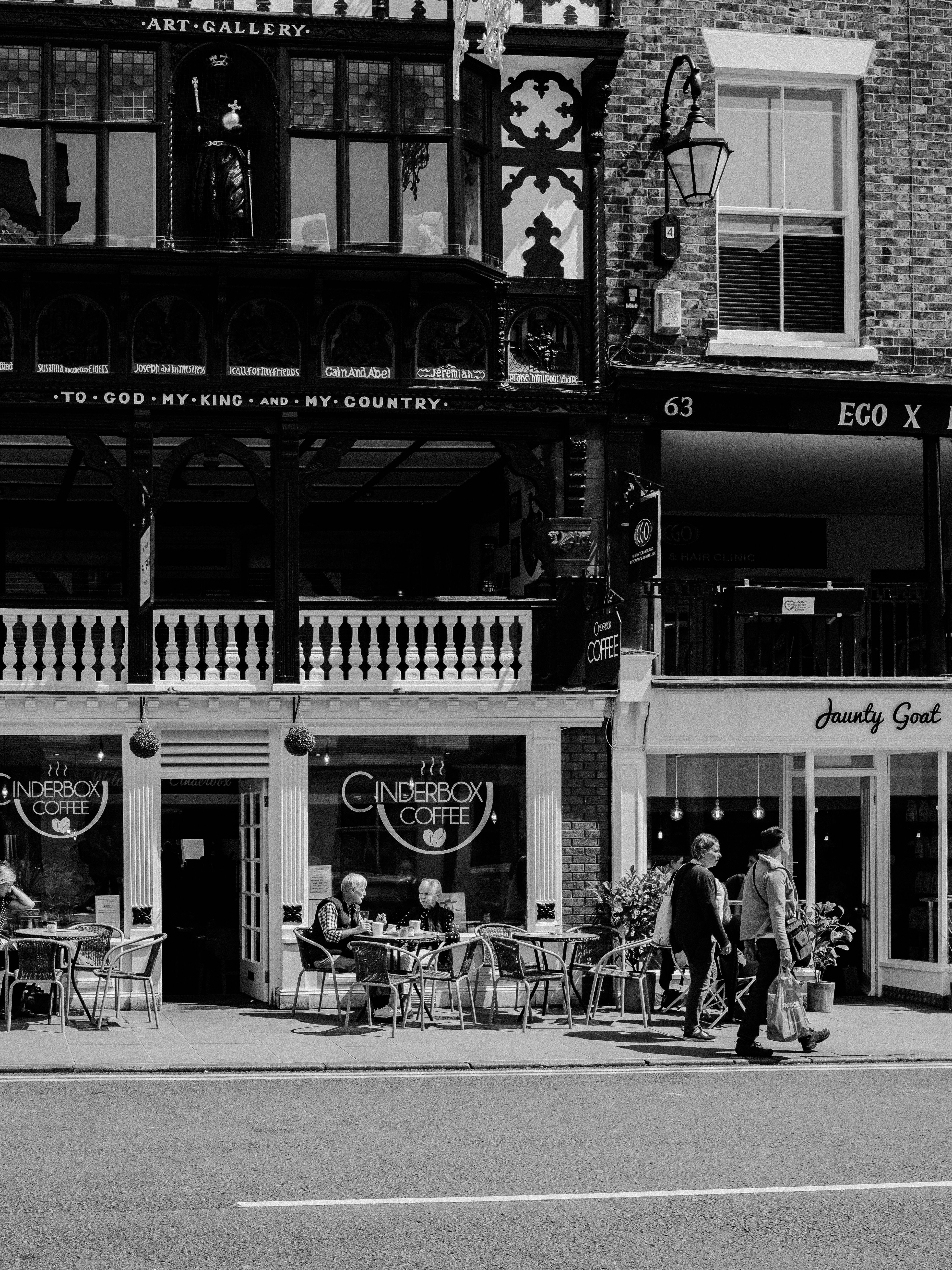 Grayscale Photo of a Coffee Shop with Customers Eating Outside · Free ...