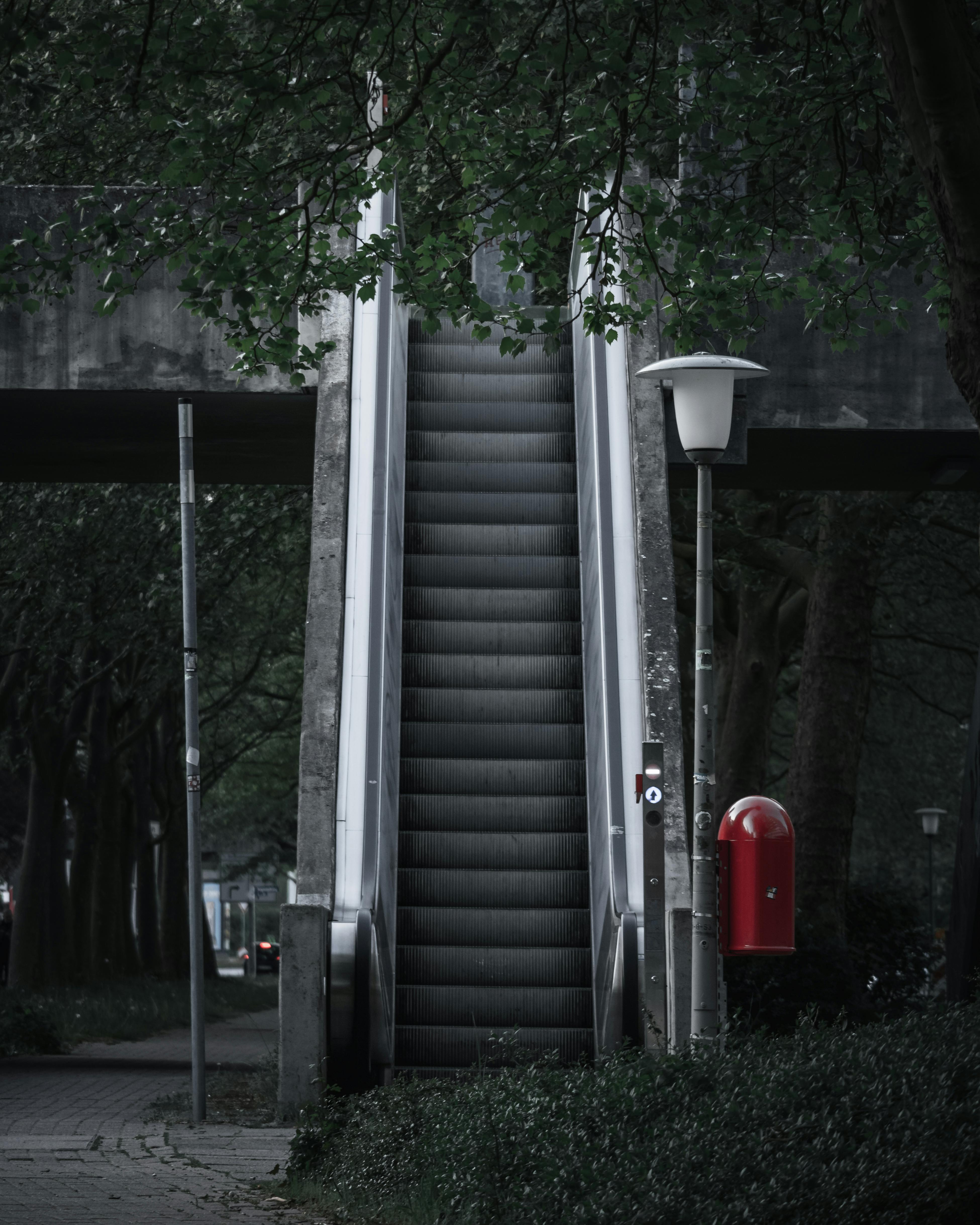 A Gray Escalator Near a Street Light · Free Stock Photo