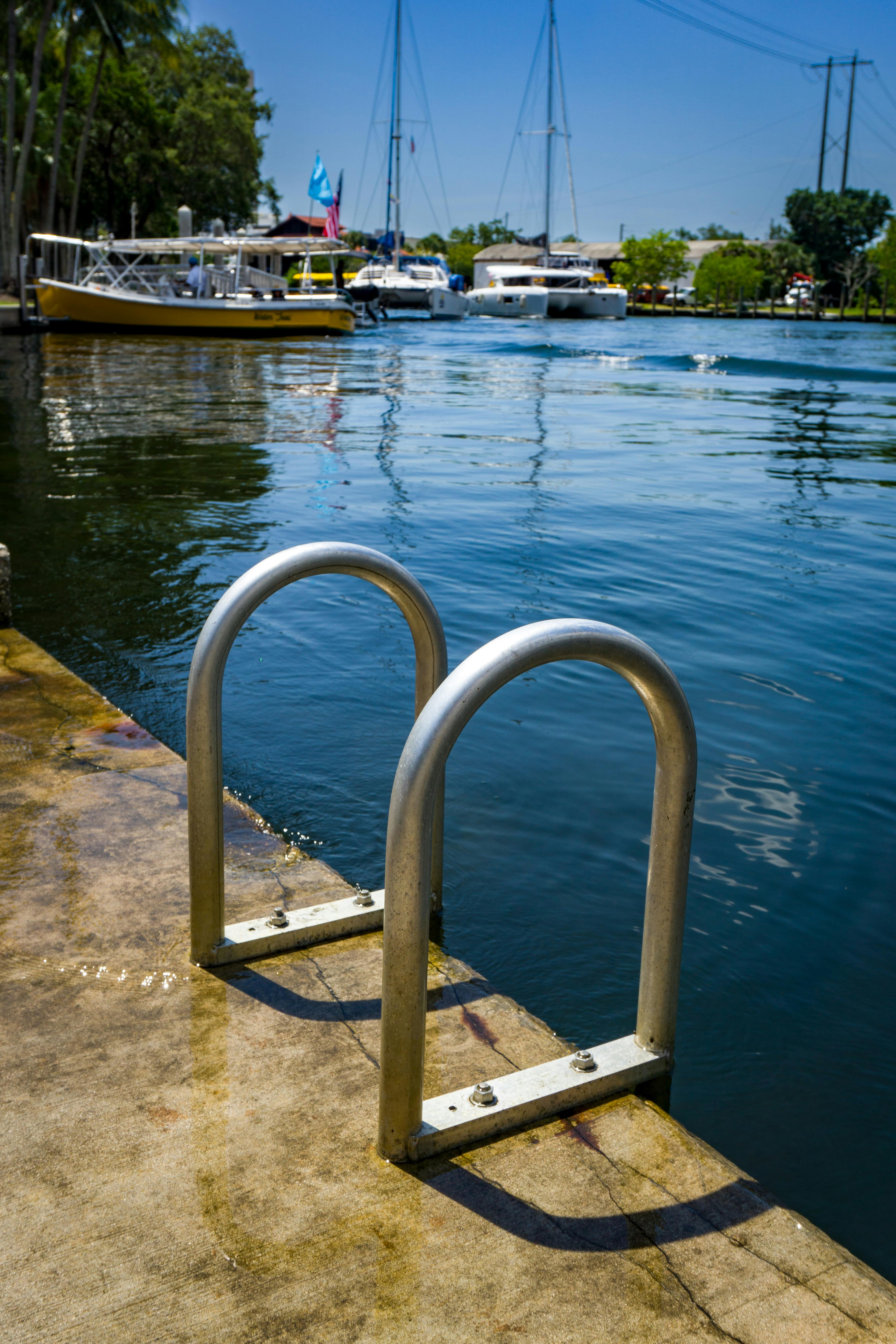 Photo of a Bay with a Ladder and Boats · Free Stock Photo
