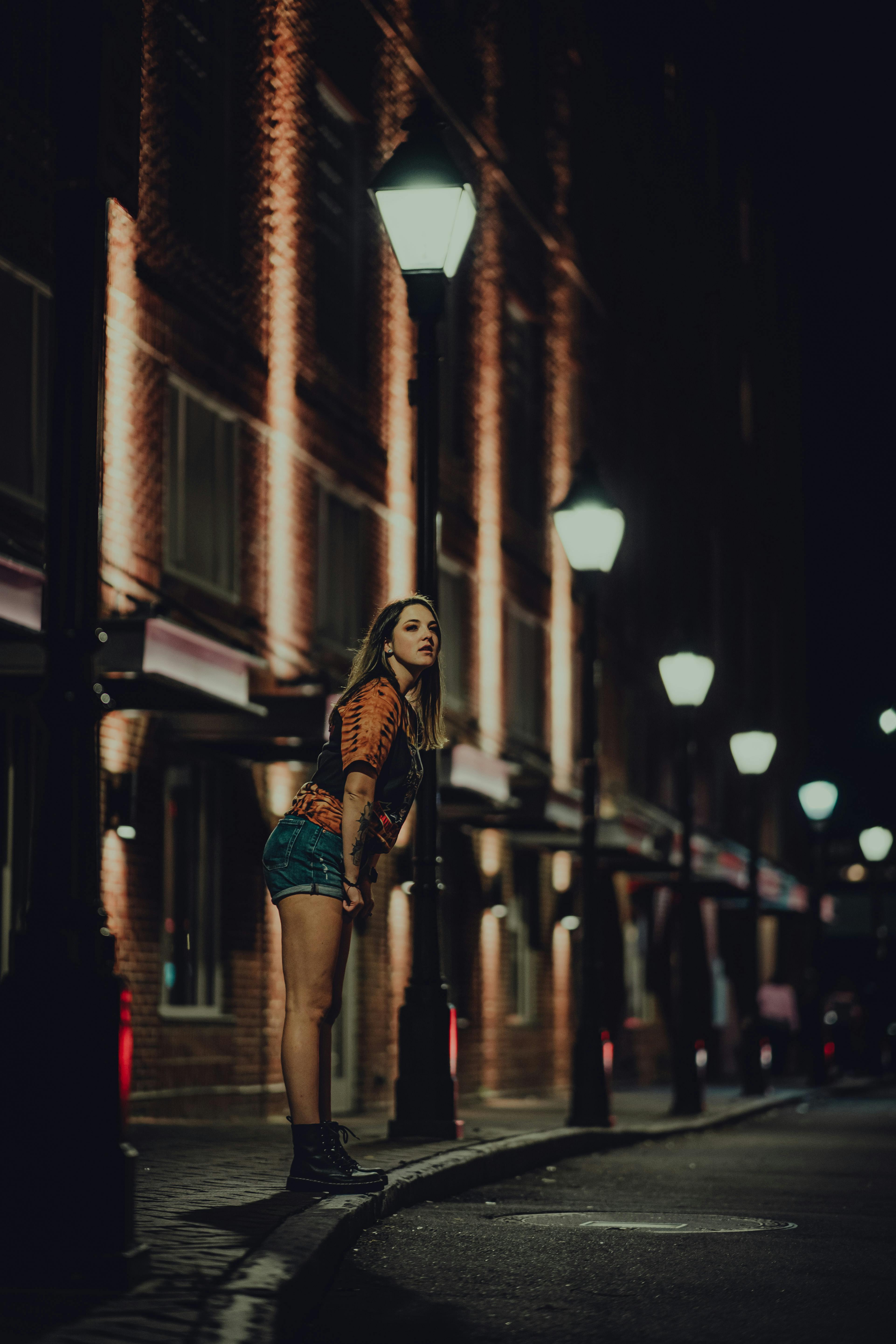 Woman Standing on Street at Night · Free Stock Photo