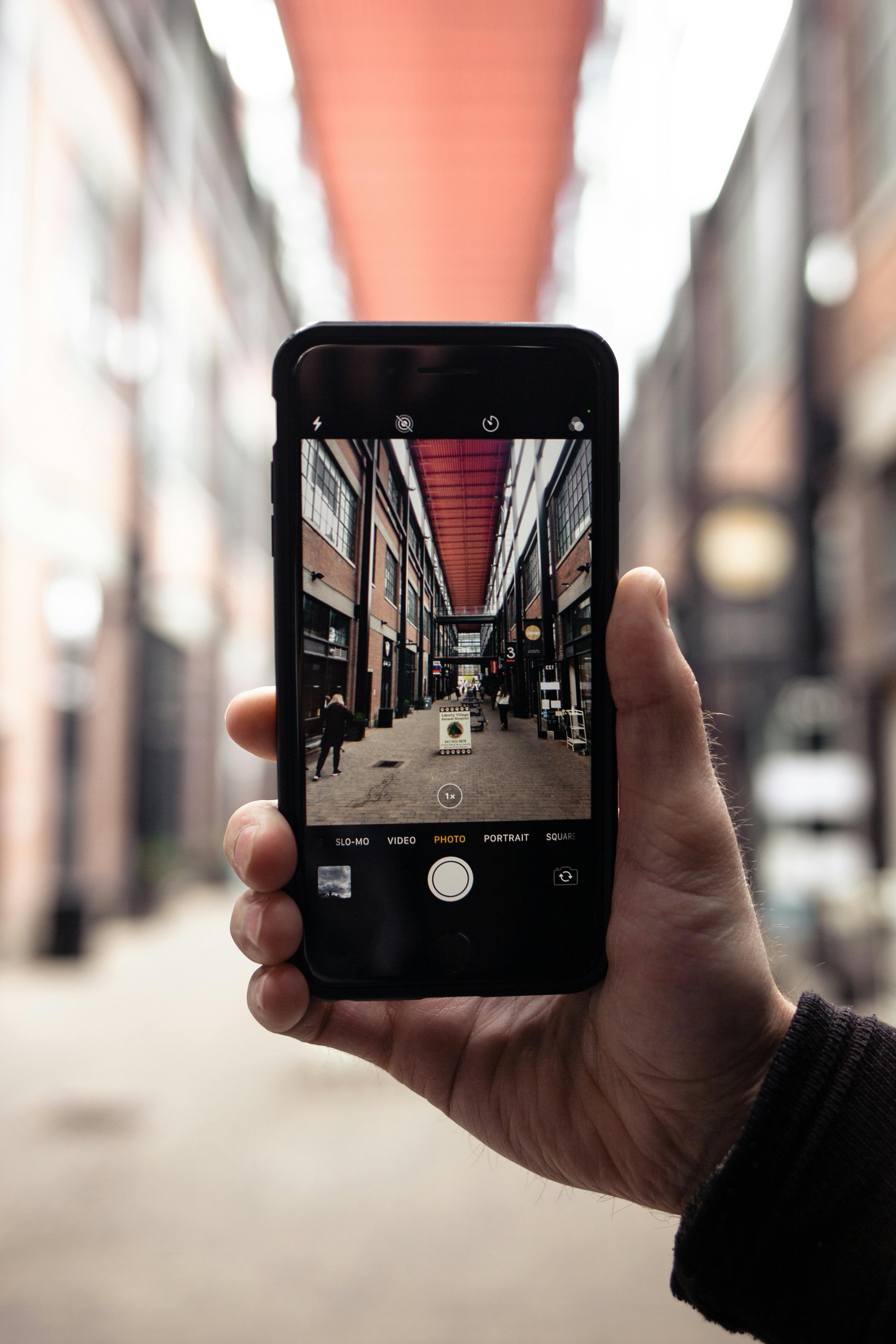 Person Holding Iphone · Free Stock Photo