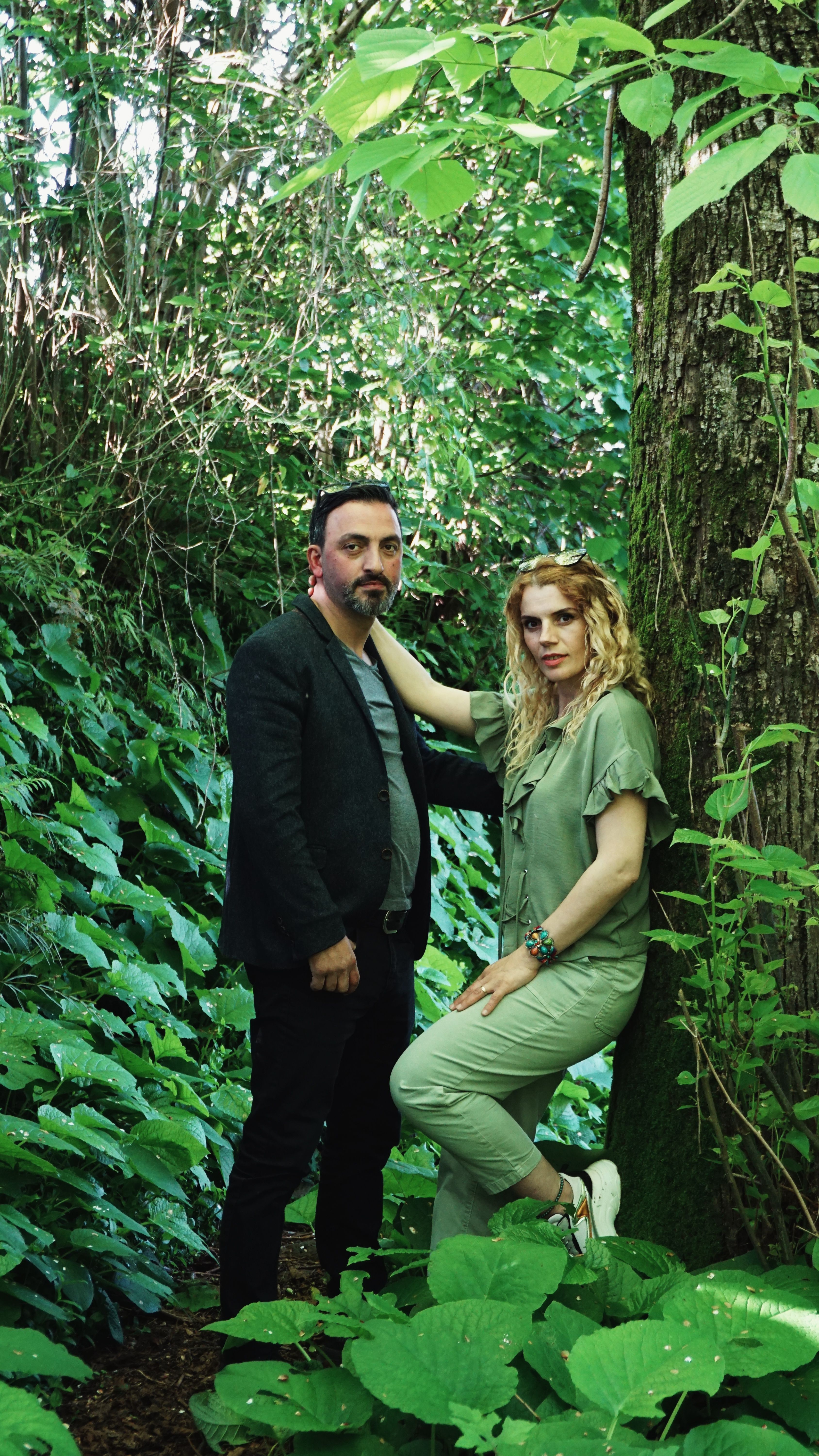 Couple Standing under Tree in Forest · Free Stock Photo