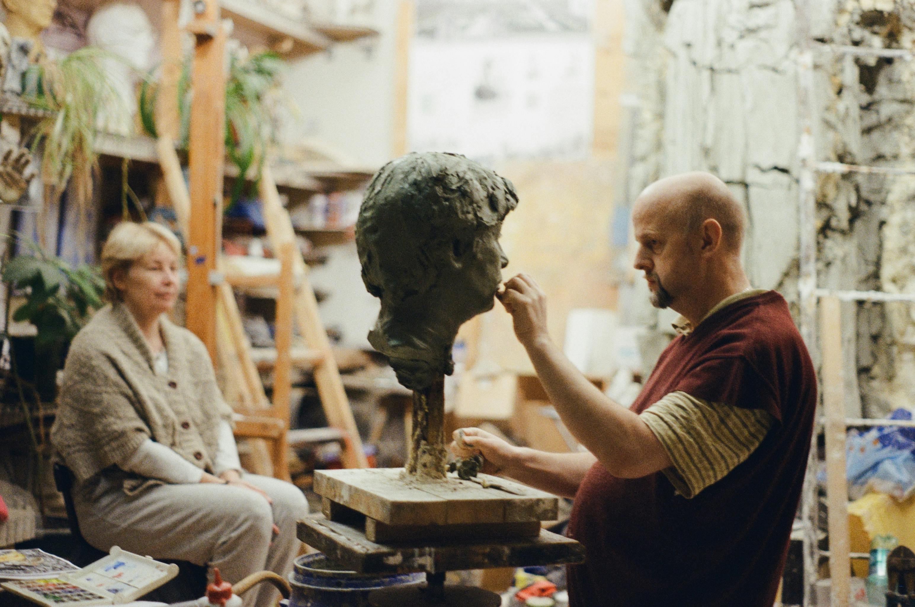 Sculptors Shaping a Clay Statue · Free Stock Photo