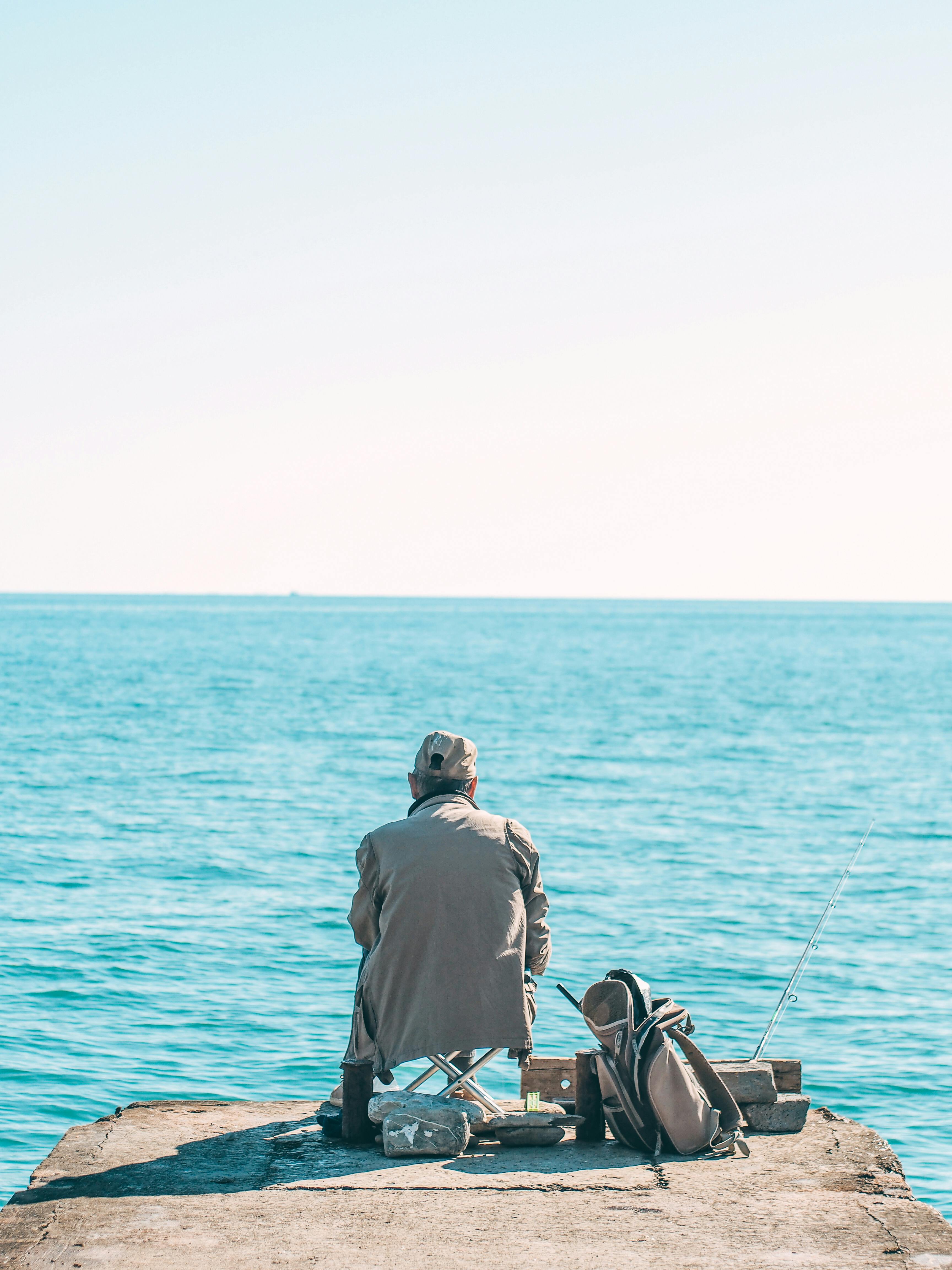 A Man Fishing on the Sea · Free Stock Photo