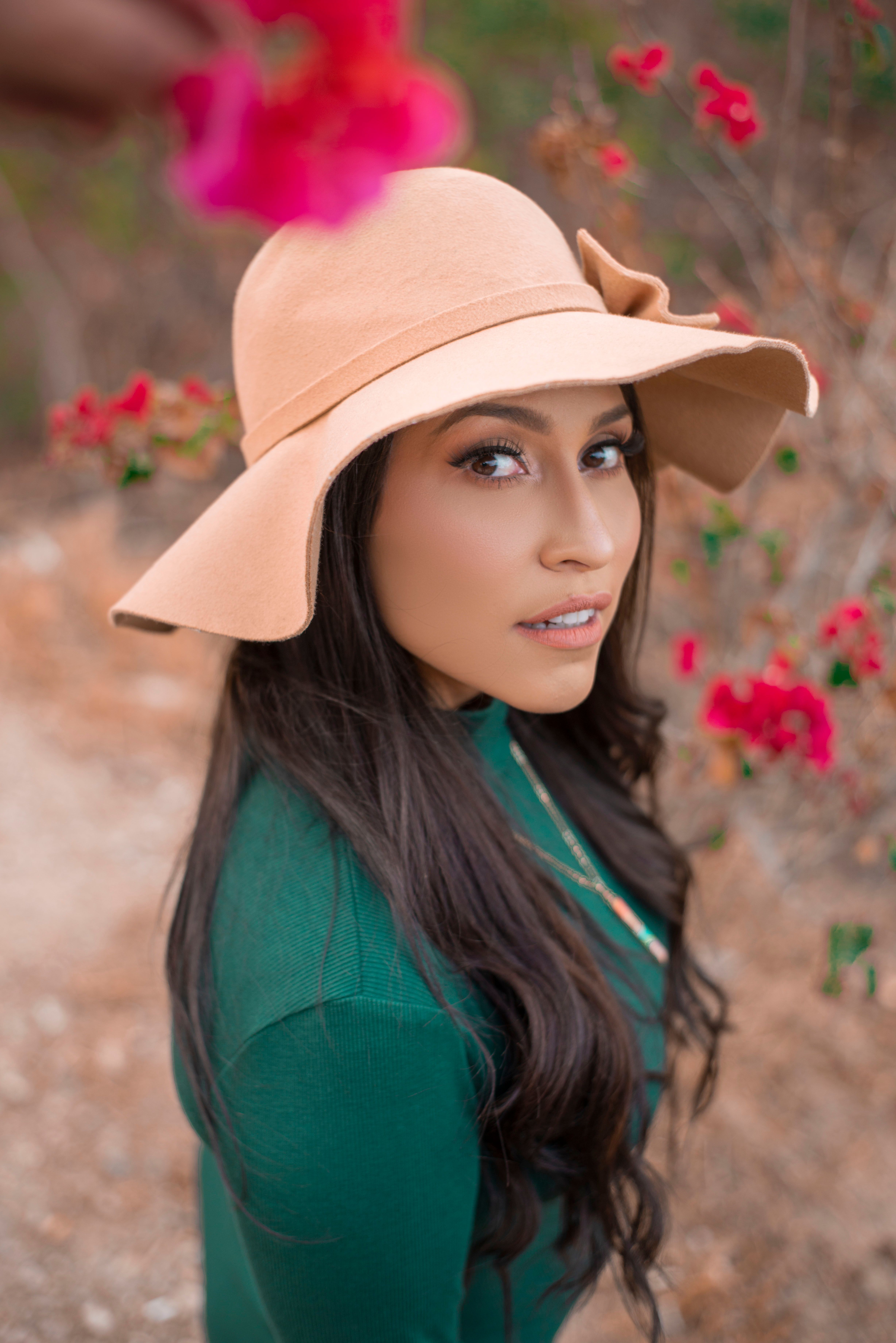Portrait of a Woman Wearing a Hat · Free Stock Photo