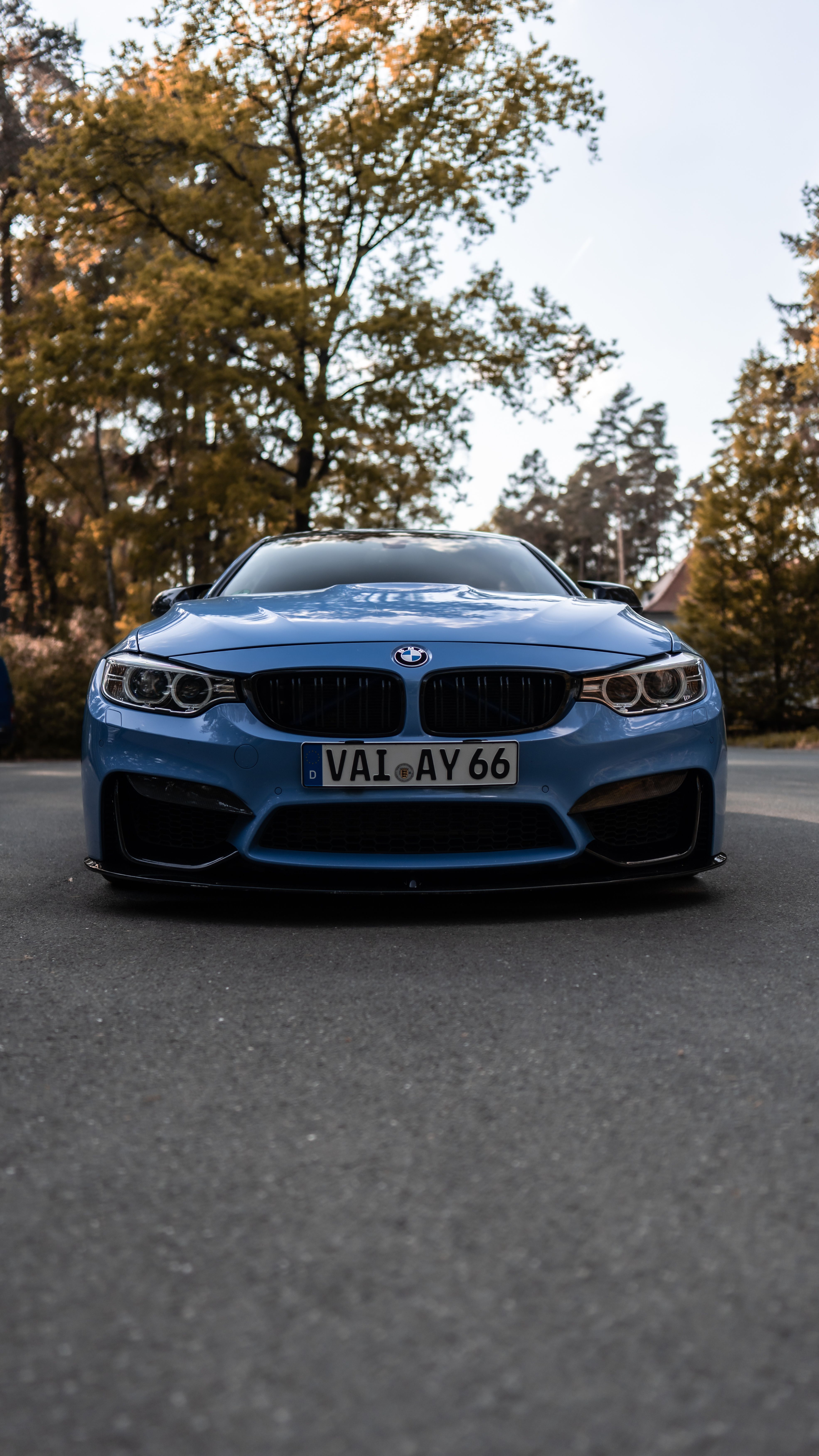 Blue Car on Concrete Road · Free Stock Photo