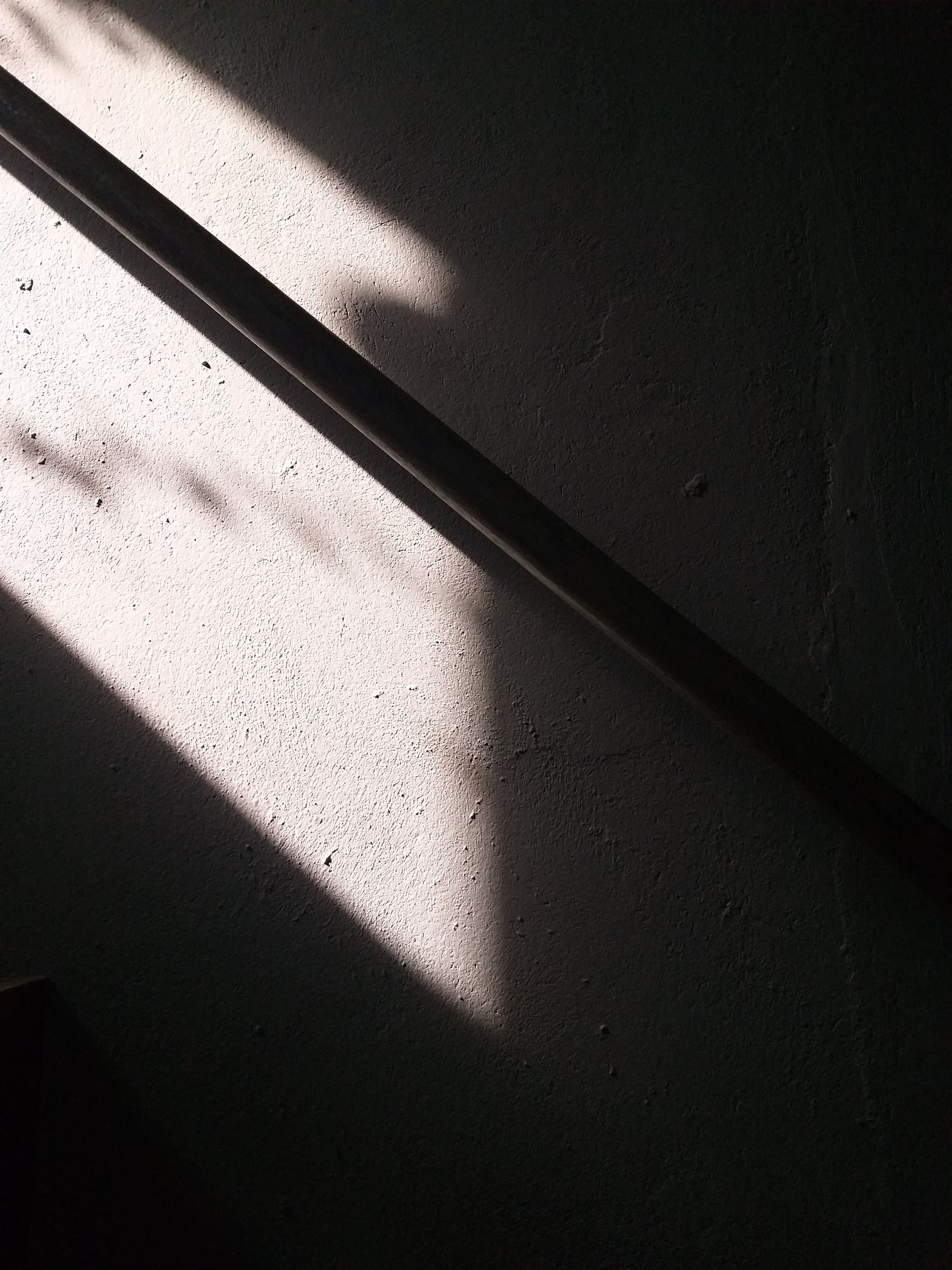 Shadow and sun light on gray wall · Free Stock Photo