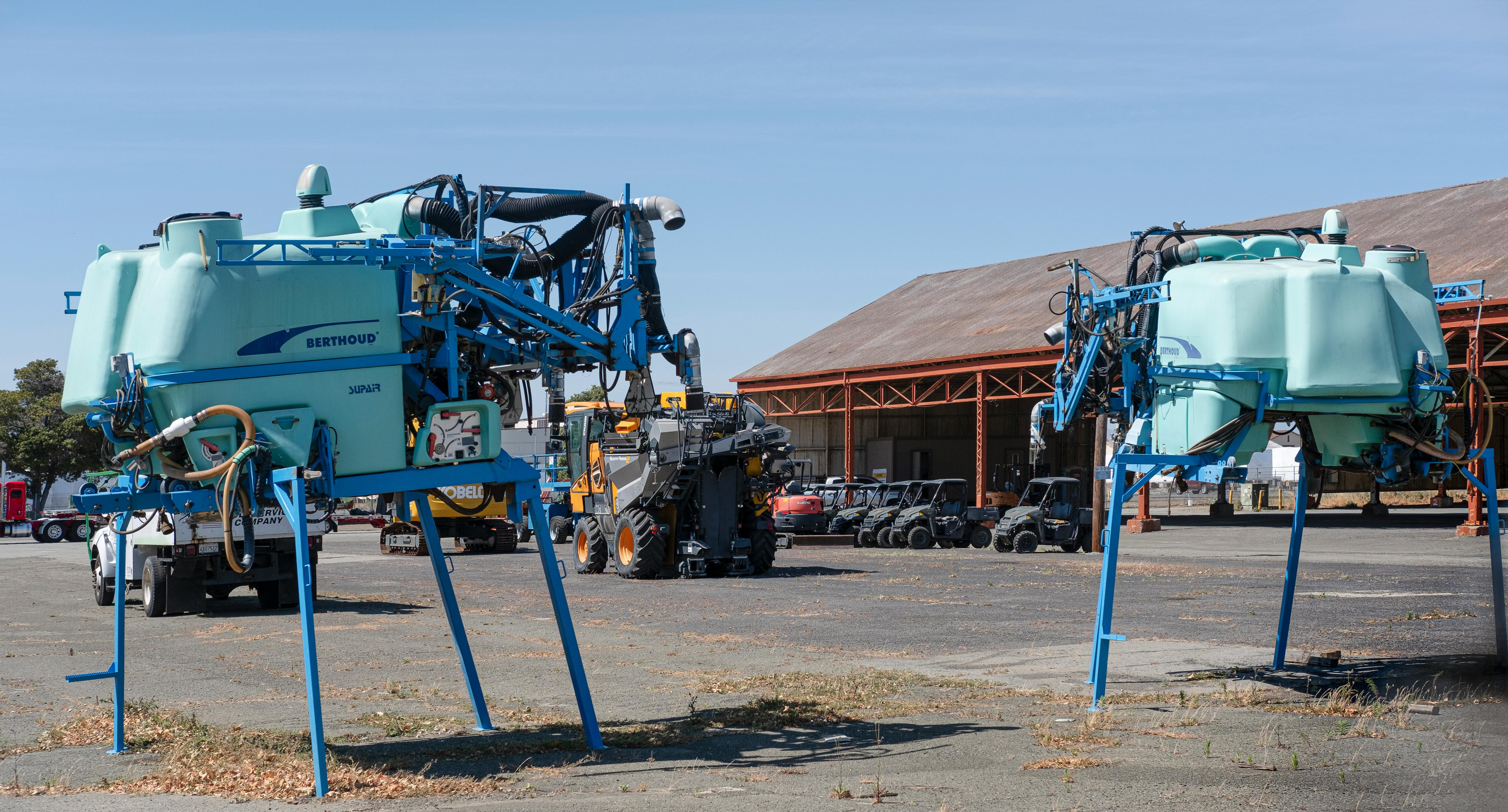 Parking Lot with Agricultural Machinery · Free Stock Photo