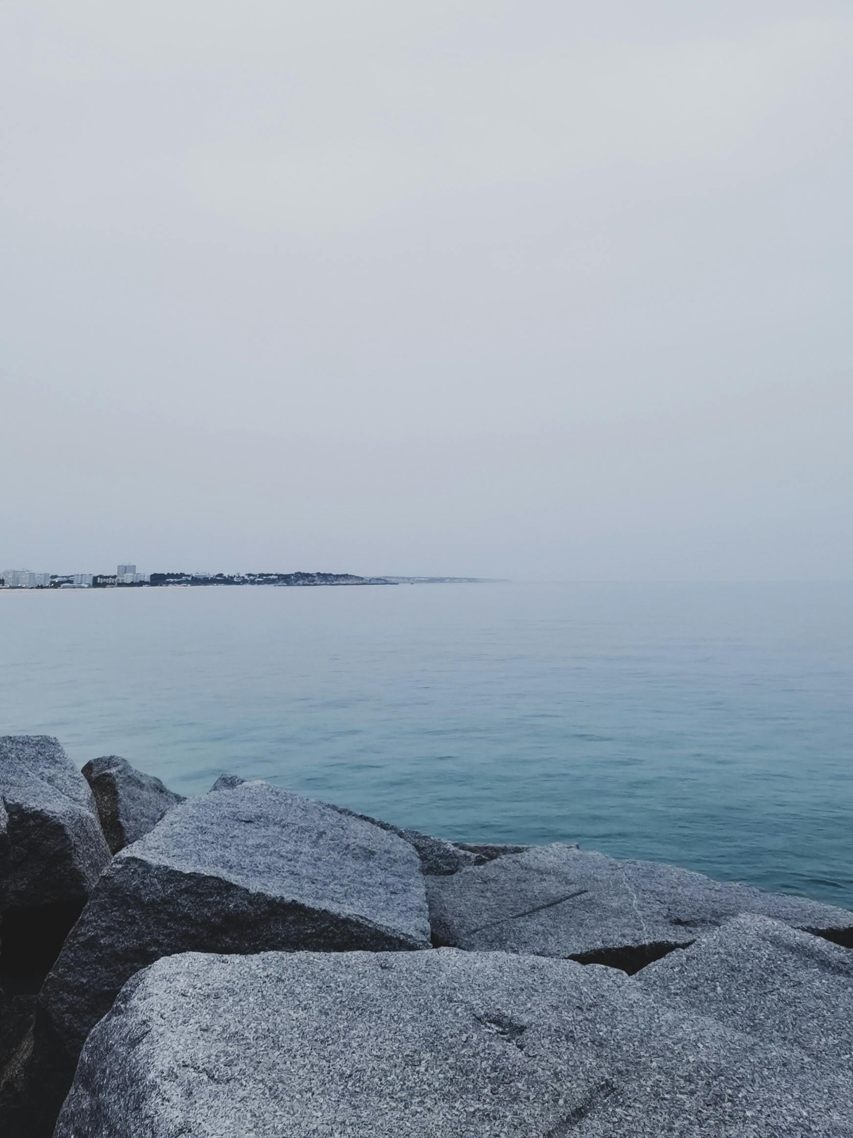 Rocks near Ocean under the Sky · Free Stock Photo