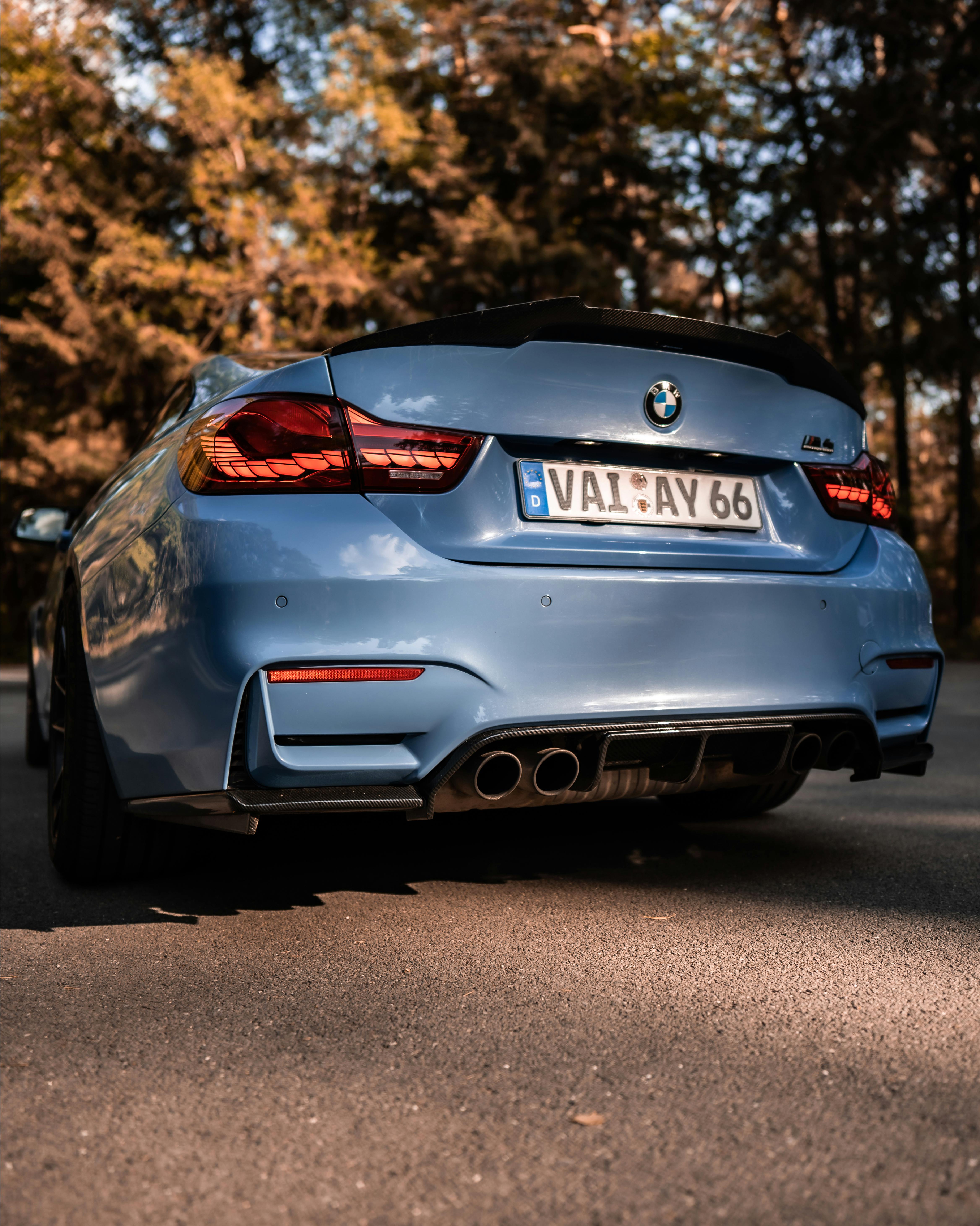 A Blue Car Parked On The Road · Free Stock Photo