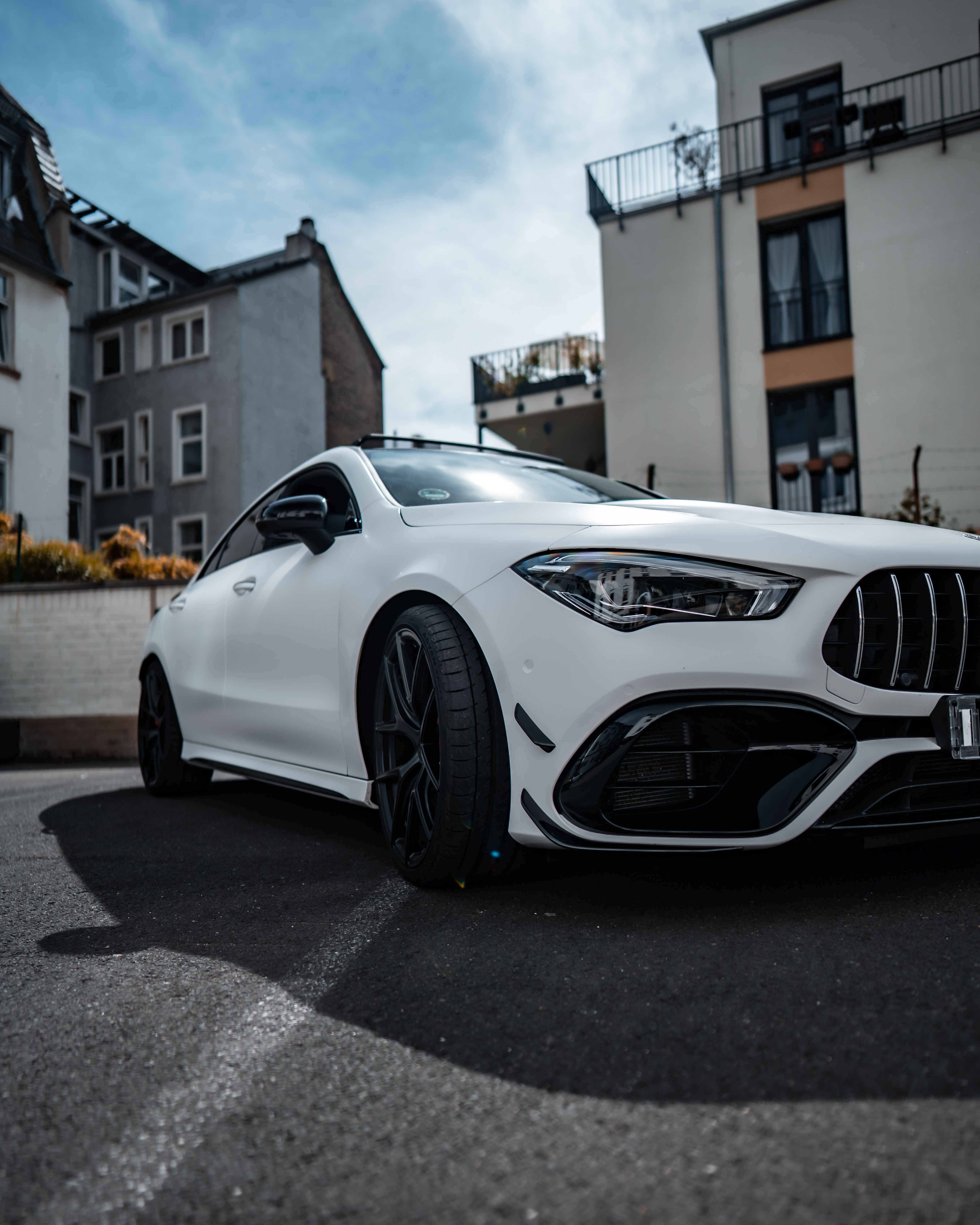 Close-Up Shot of a White Car · Free Stock Photo