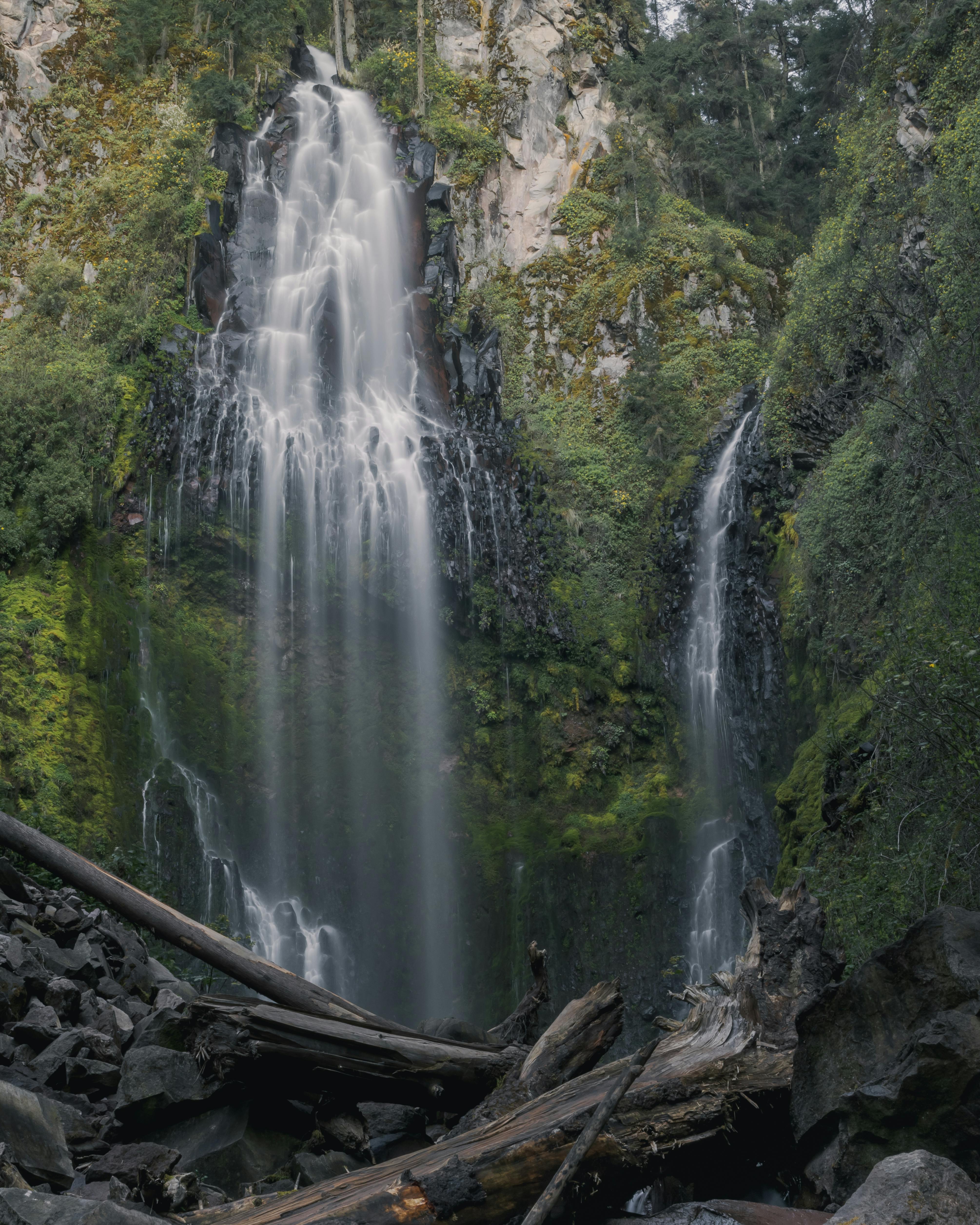 High Waterfalls Cascading Down the Mountain Cliff · Free Stock Photo