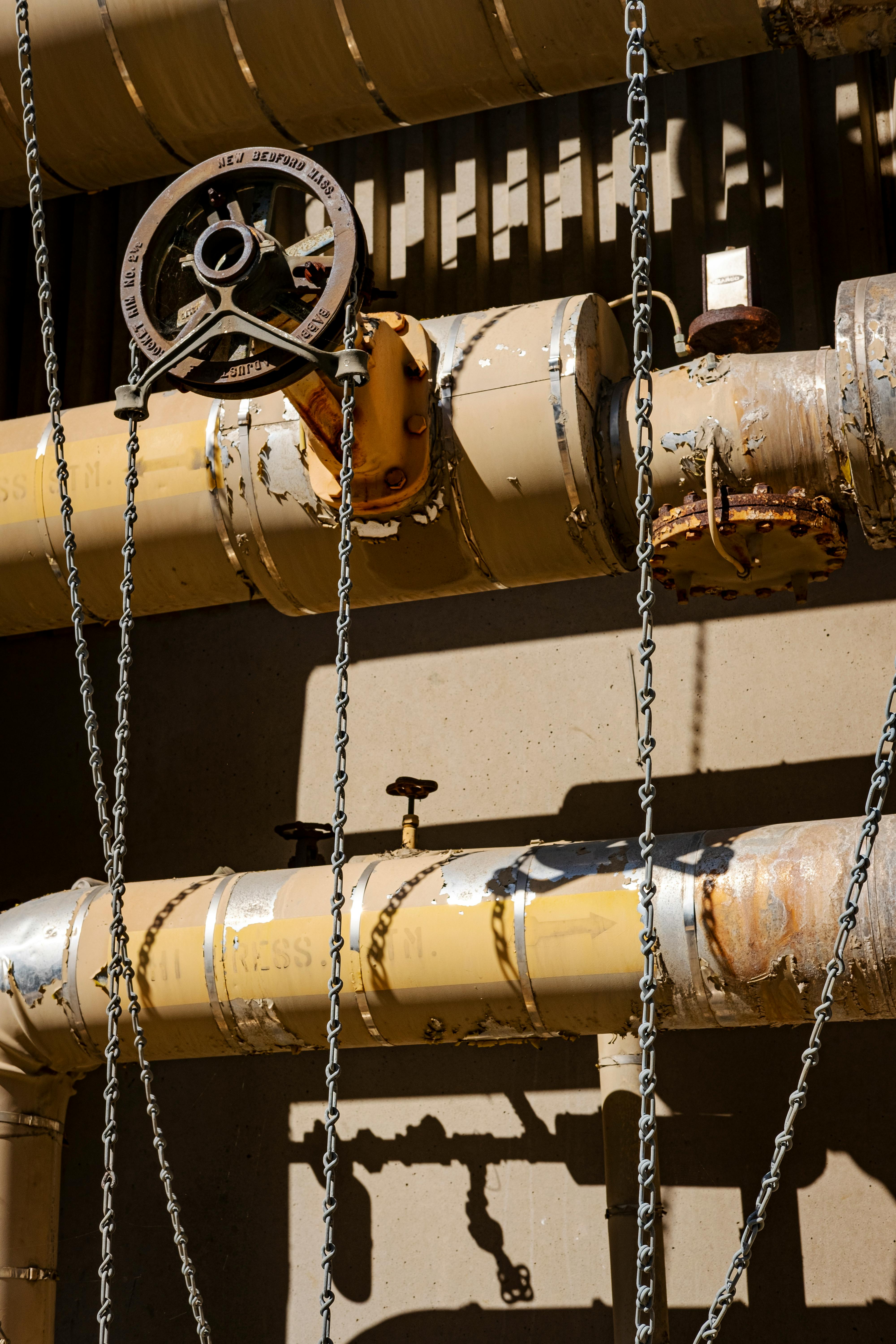 White and Black Metal Pipe and Chains · Free Stock Photo
