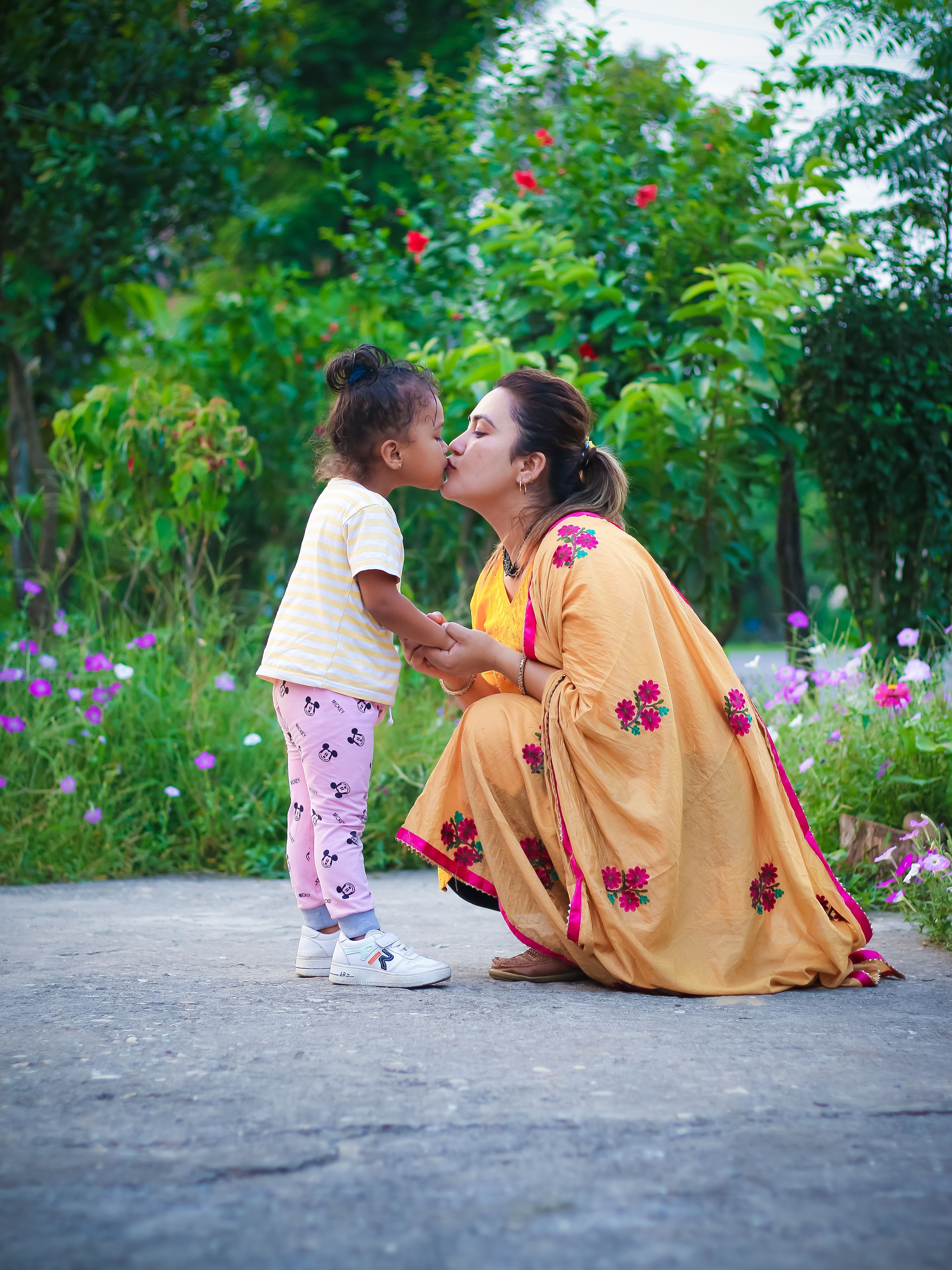 Mother and Child Enjoying Lagerstroemia Flowers · Free Stock Photo