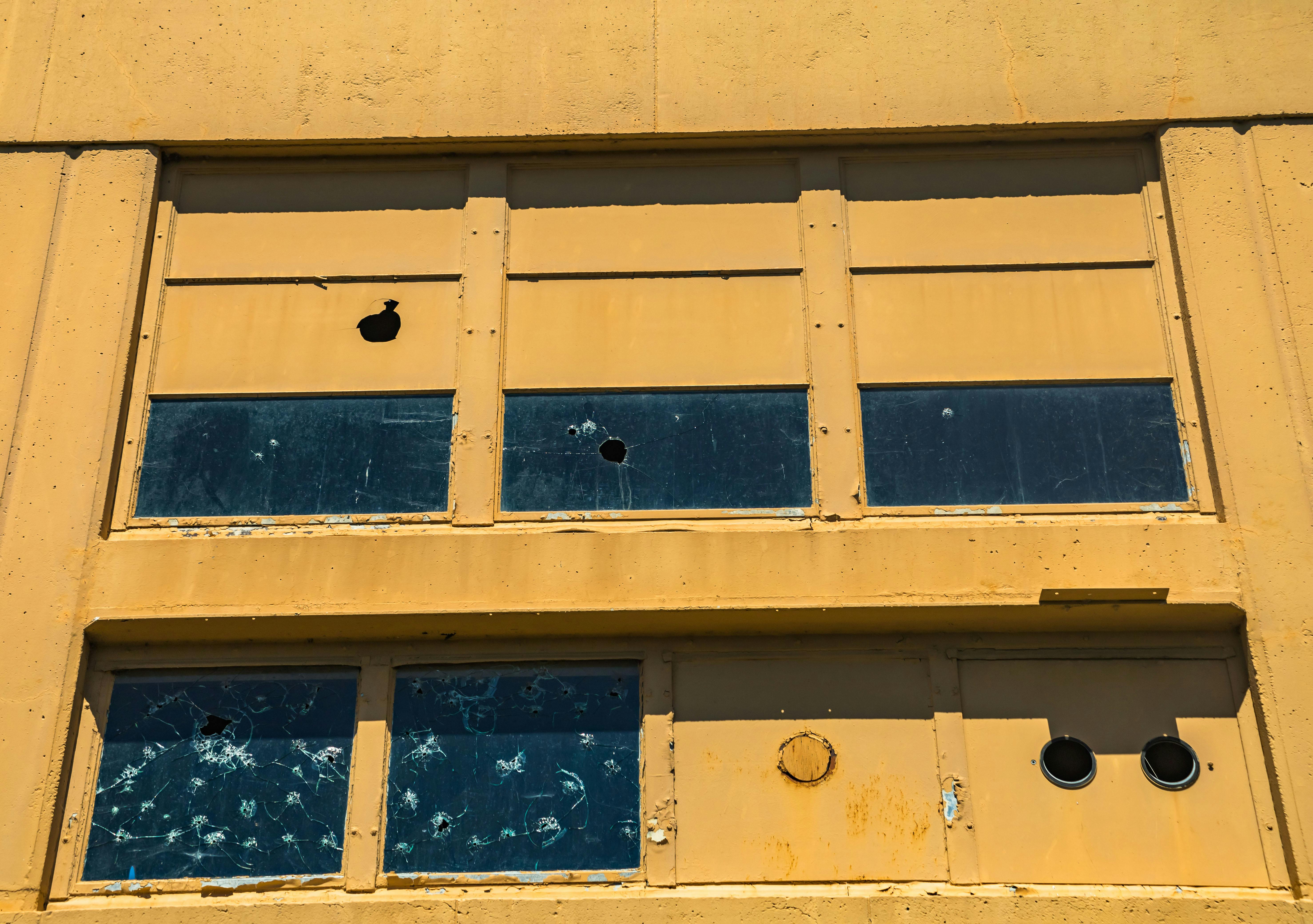 A Building with Broken Windows · Free Stock Photo
