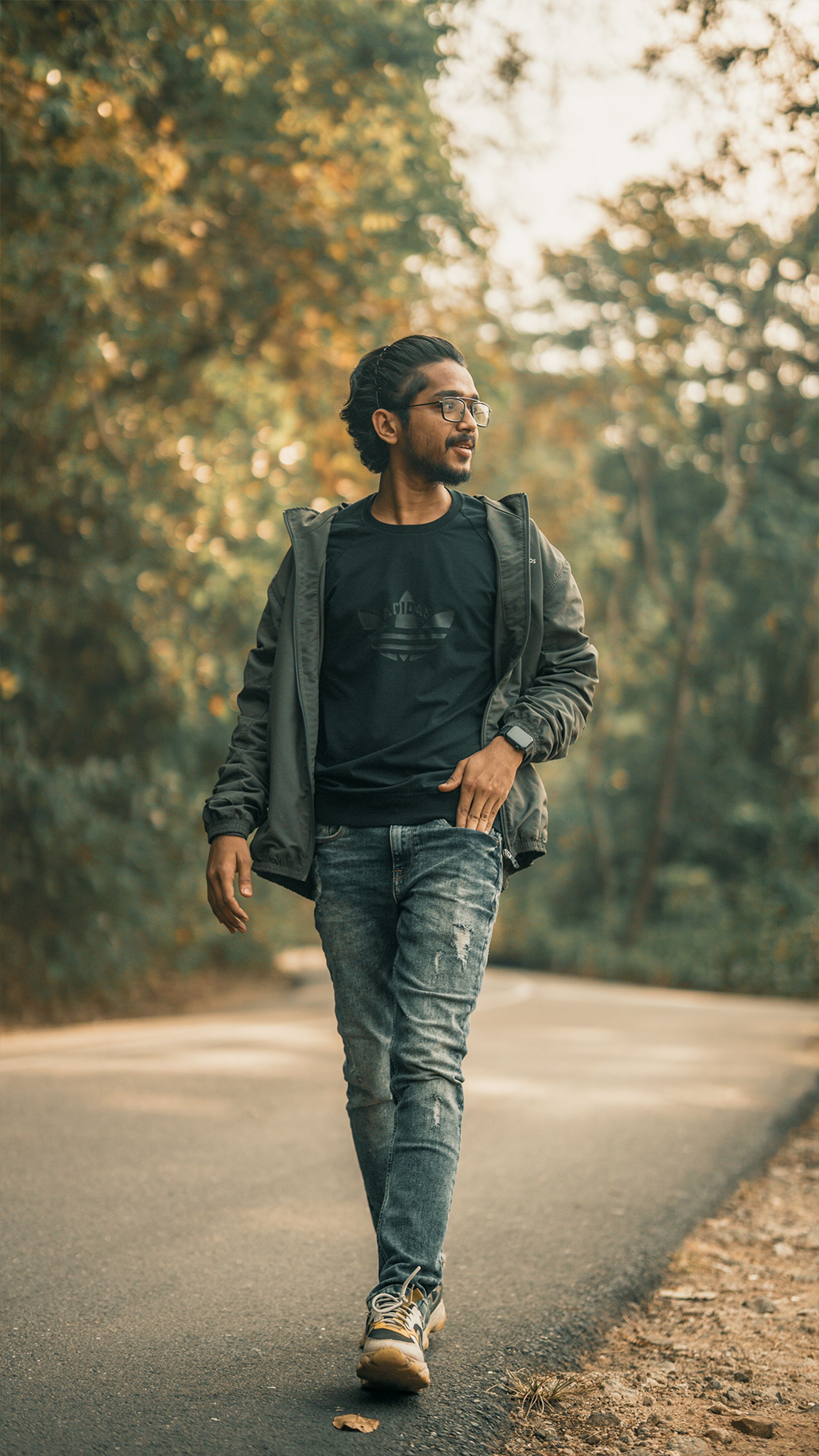 A Man Walking on Sidewalk · Free Stock Photo