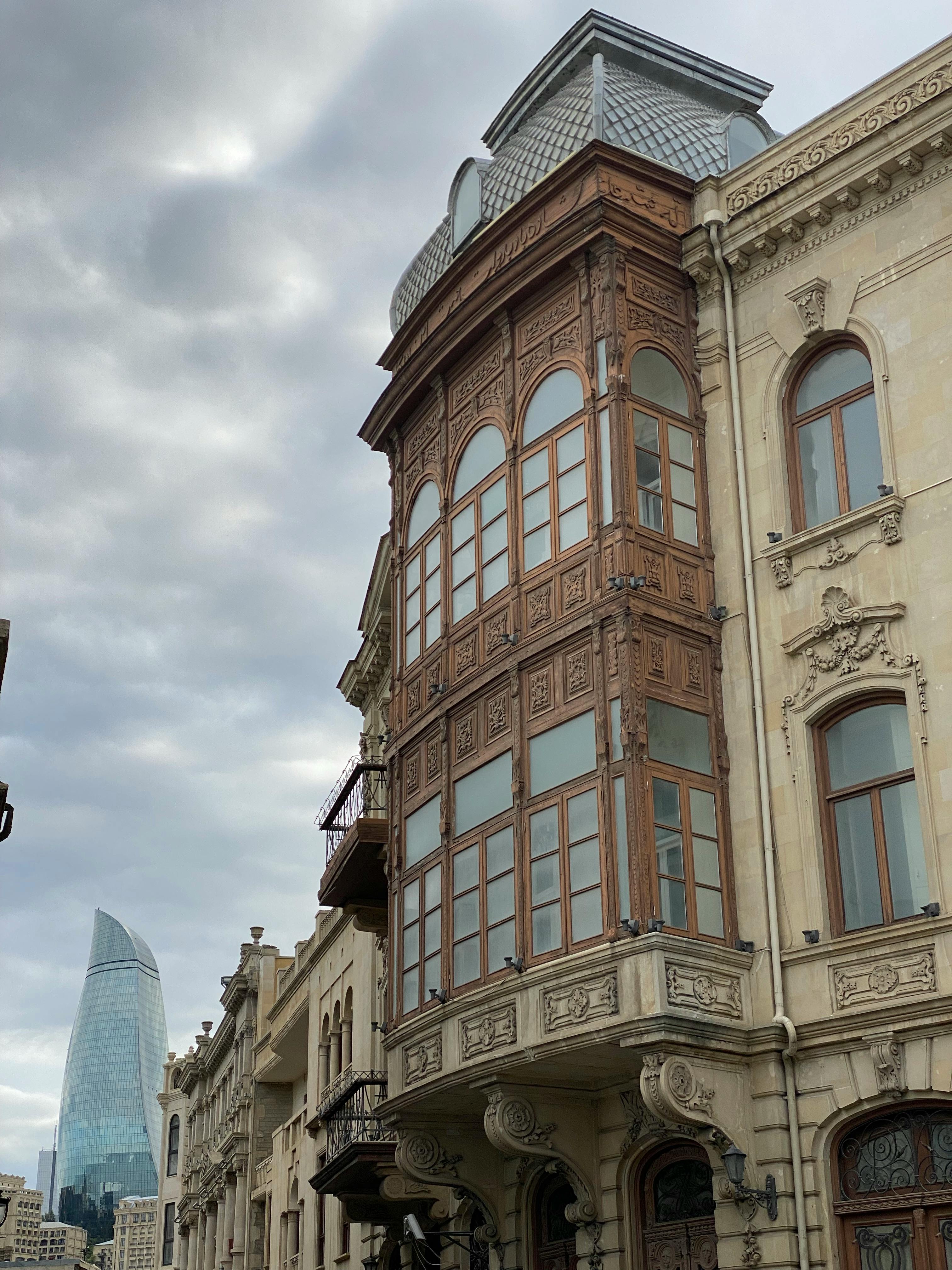 Brown Concrete Building Under White Clouds · Free Stock Photo
