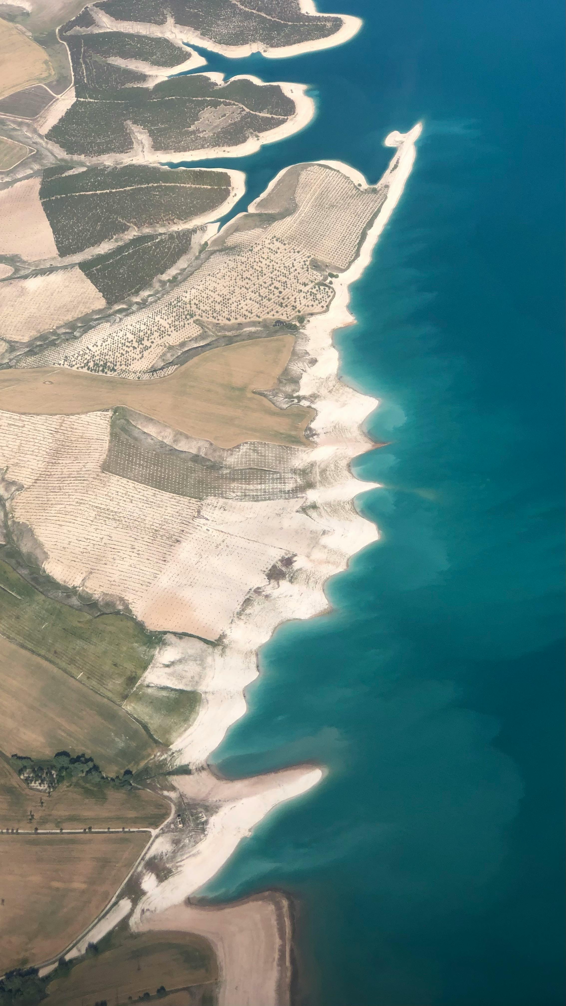 Aerial View of Natural Landscape Near Body of Water · Free Stock Photo