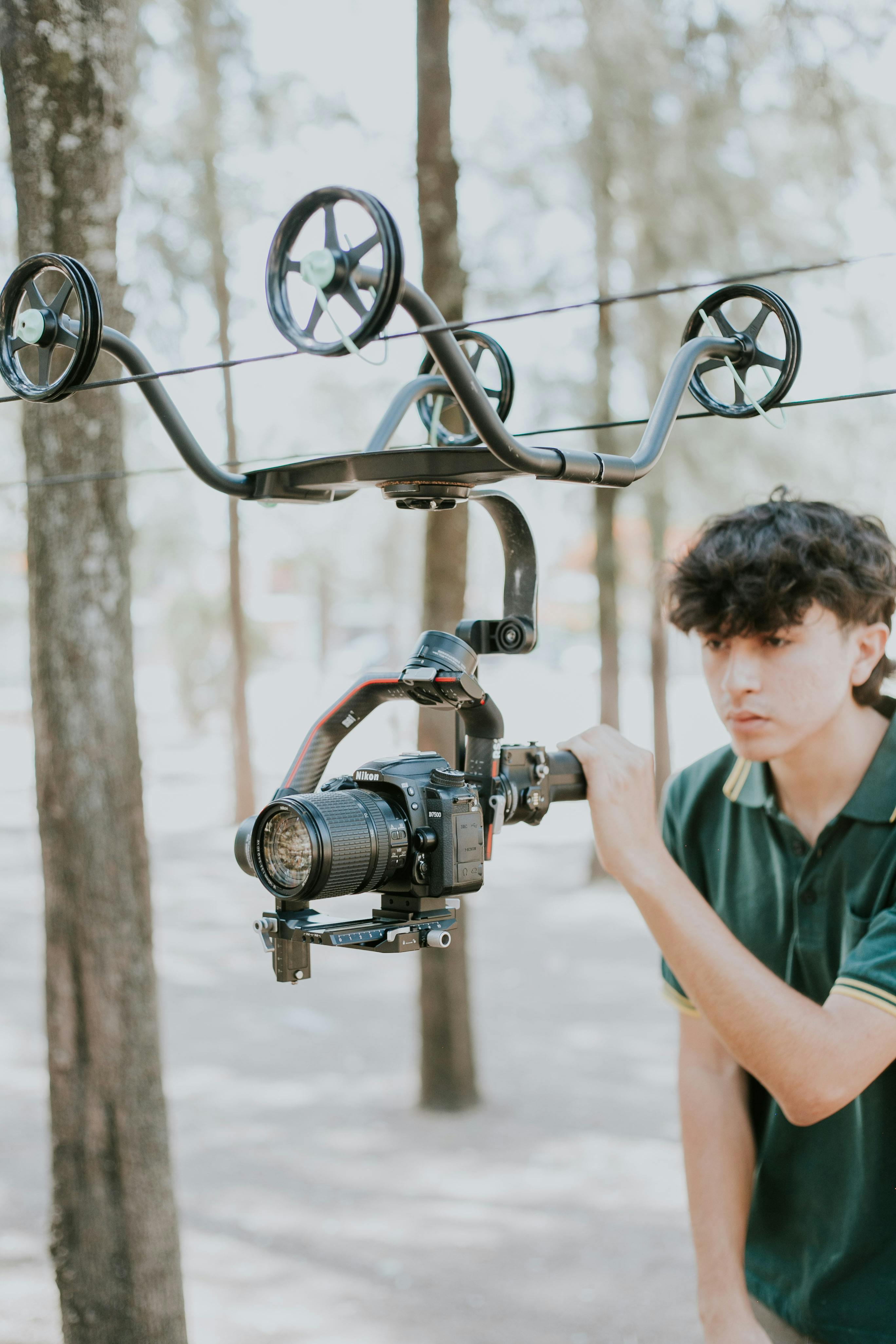 Man Holding a Professional Camera · Free Stock Photo