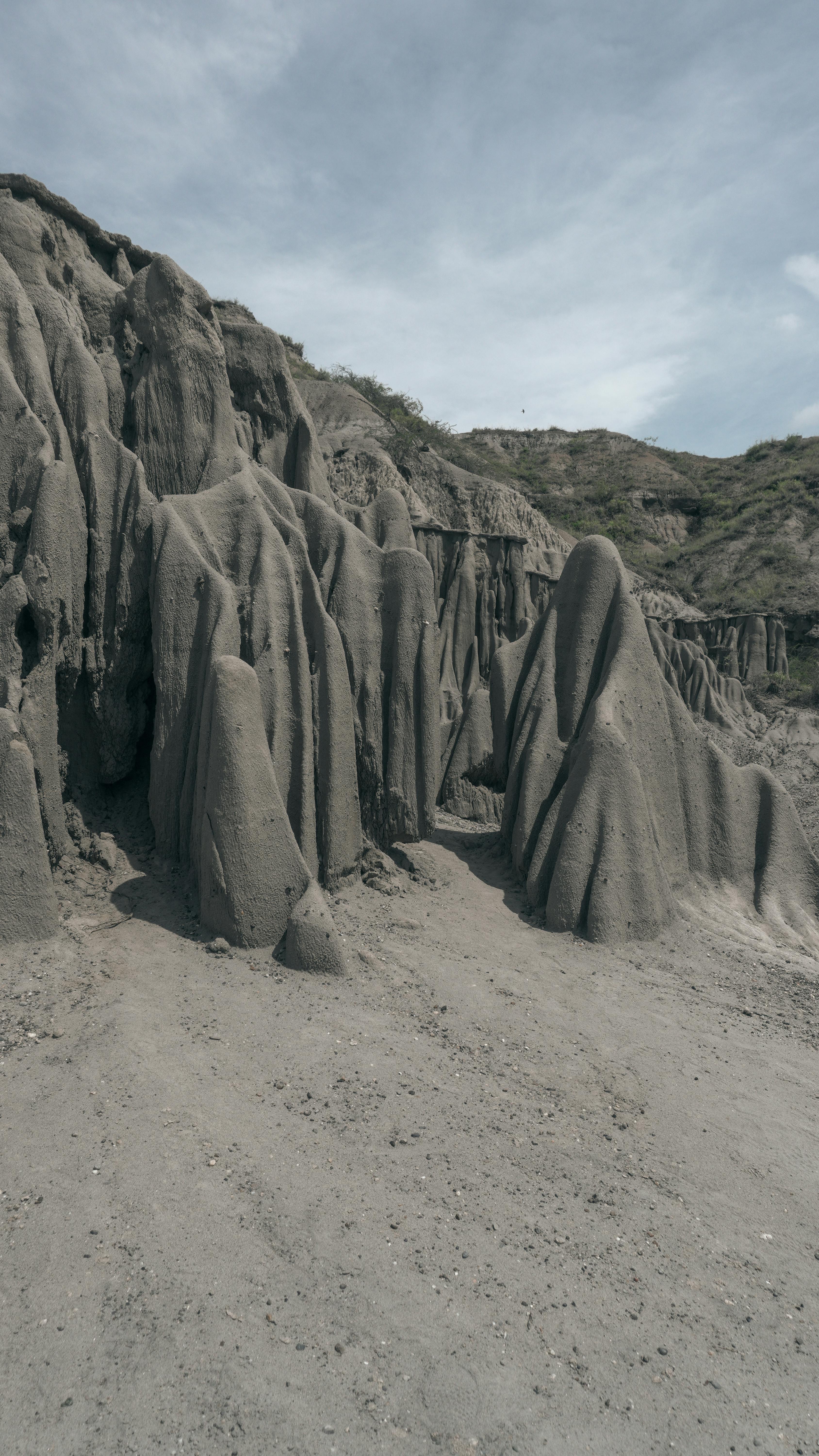 Tall Rock Formations Under the Cloudy Sky · Free Stock Photo