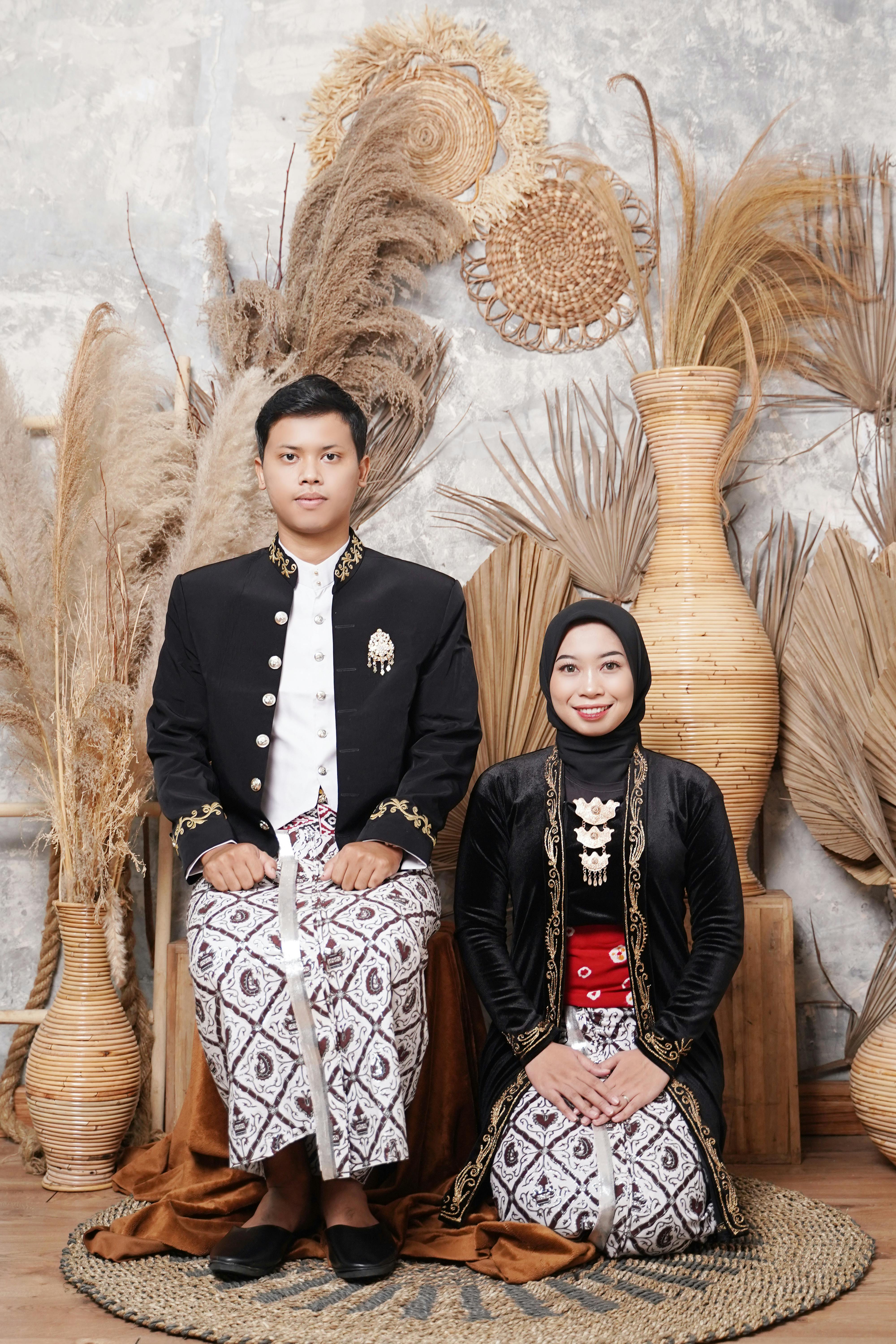 Couple in Traditional Wear · Free Stock Photo