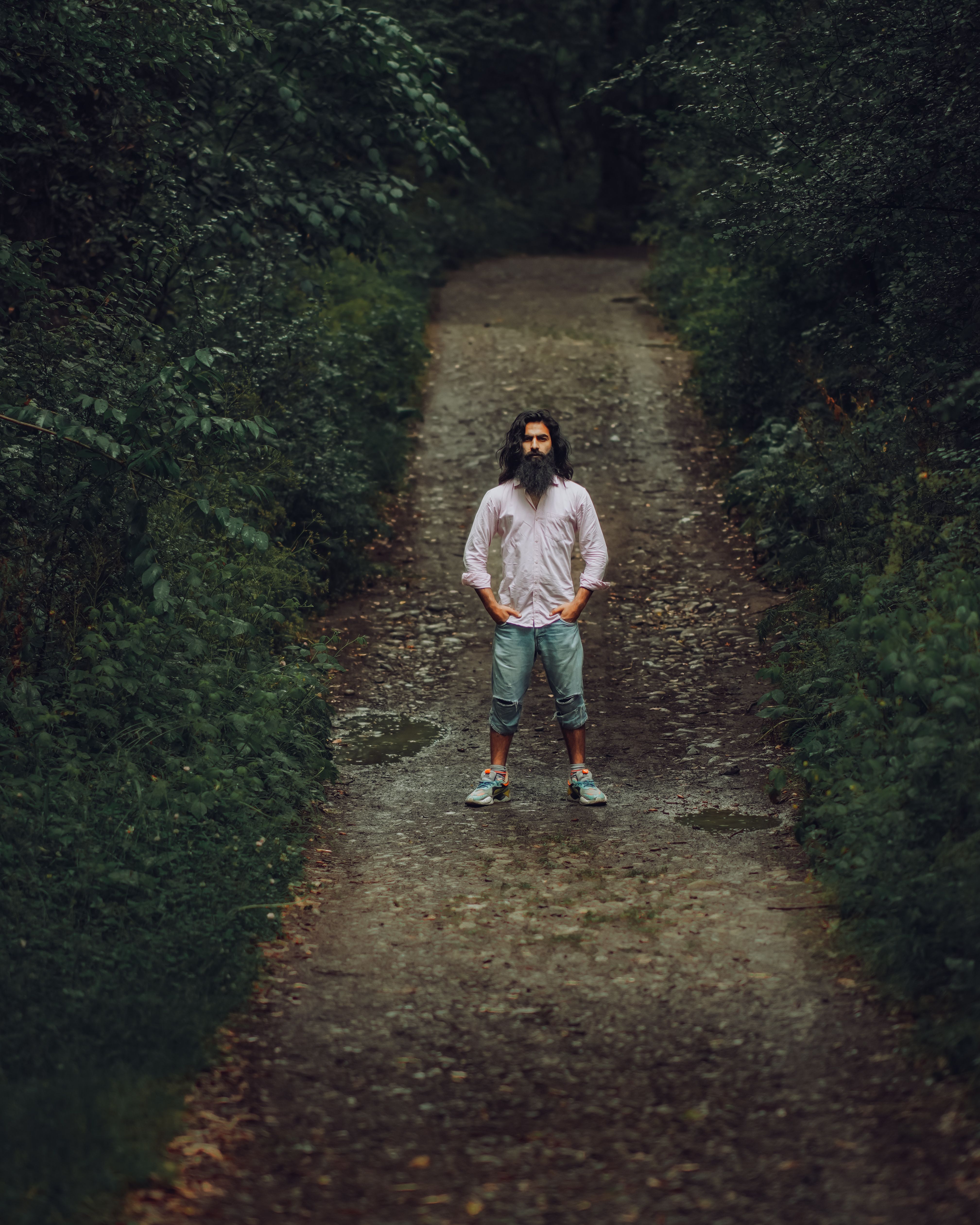 Man standing in an Unpaved Pathway in Tilt-shift Lens · Free Stock Photo