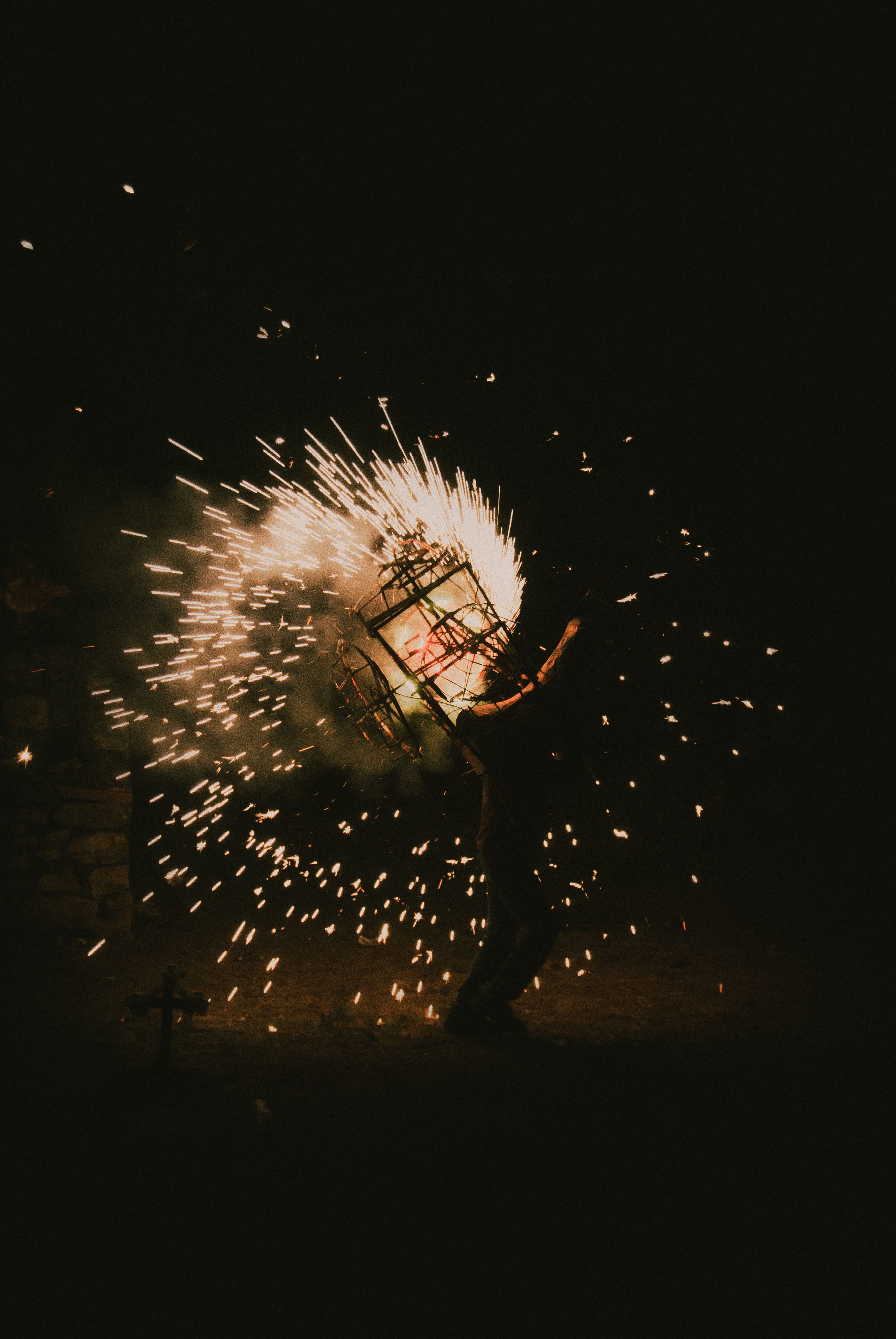 Man Holding a Sparkling Construction · Free Stock Photo