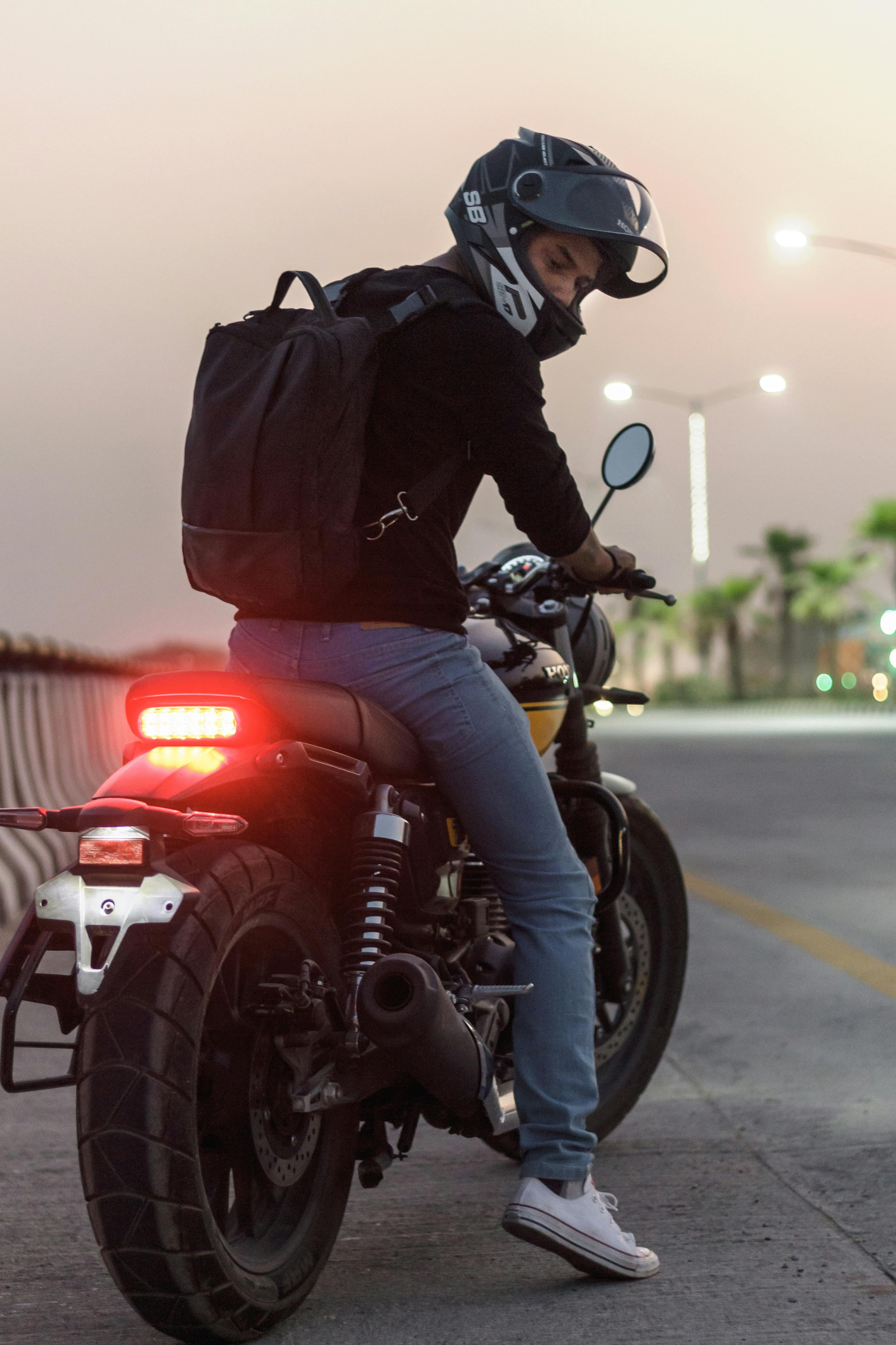 Man Riding a Motorcycle Looking Back · Free Stock Photo