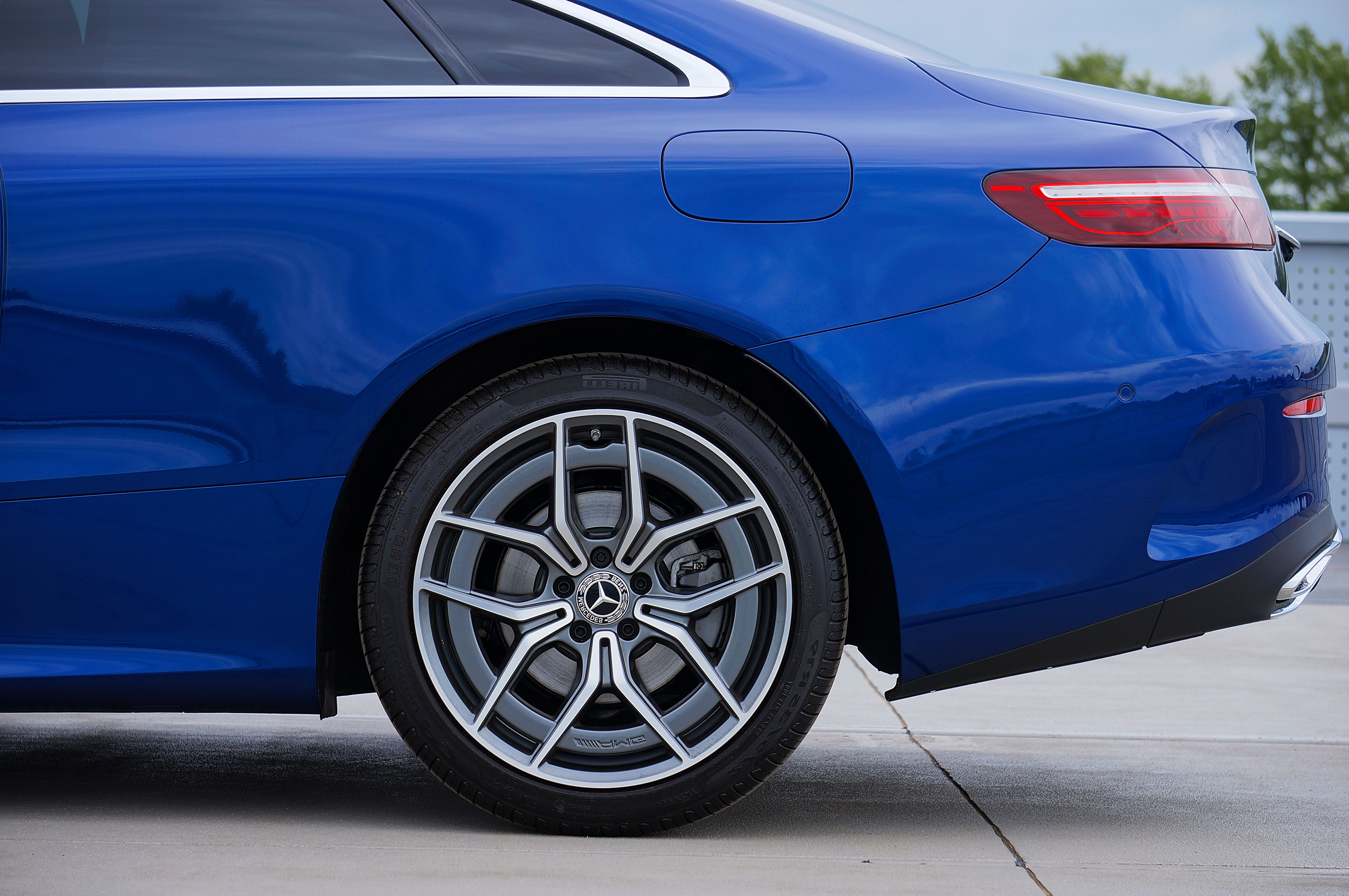 A Blue Car Parked on Concrete Floor · Free Stock Photo
