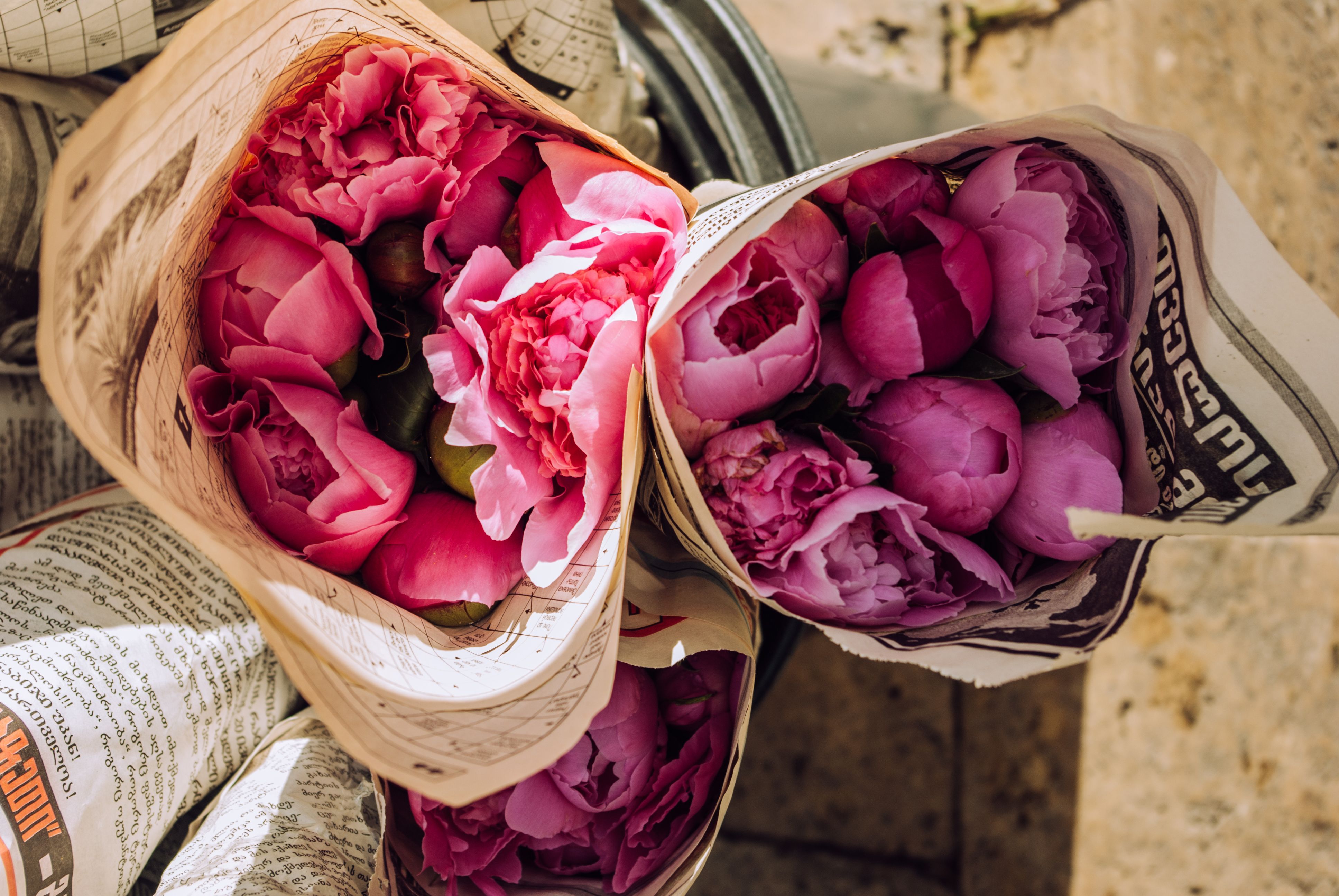 Bouquets Wrapped in Newspapers · Free Stock Photo