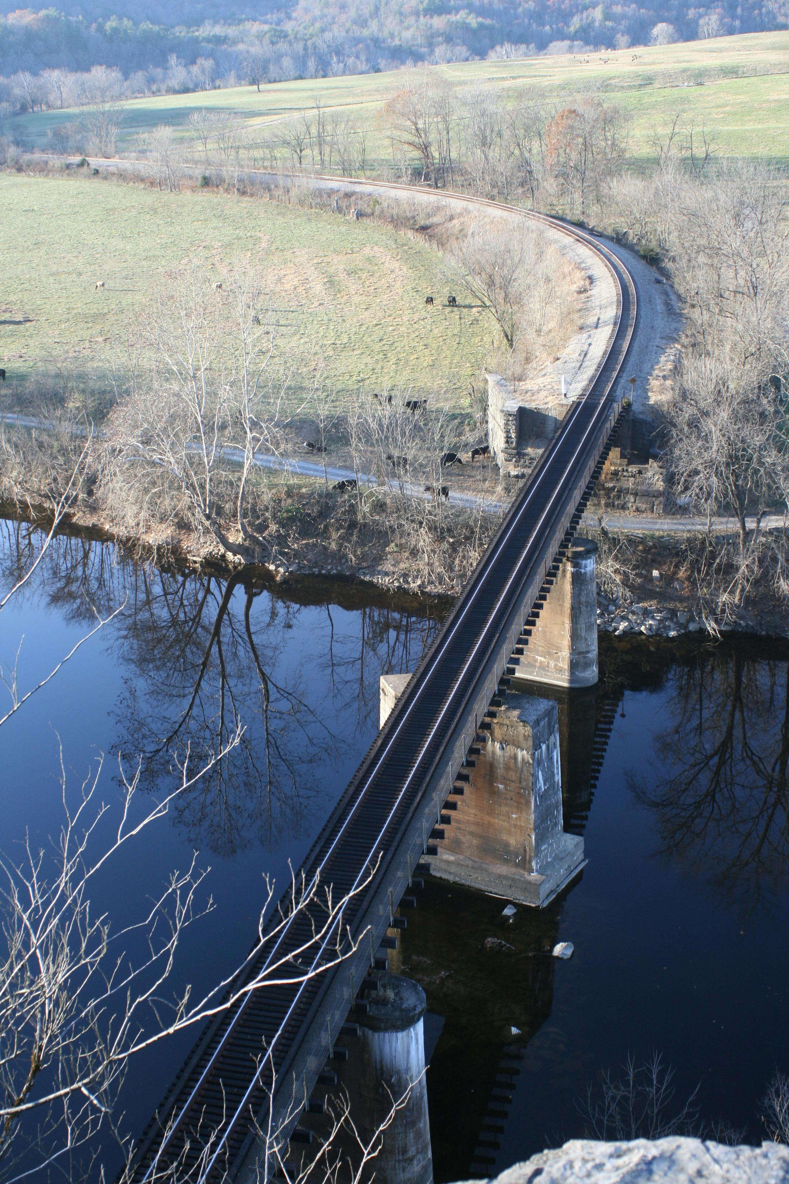Aerial Footage of Train Tracks over Water Canal · Free Stock Photo