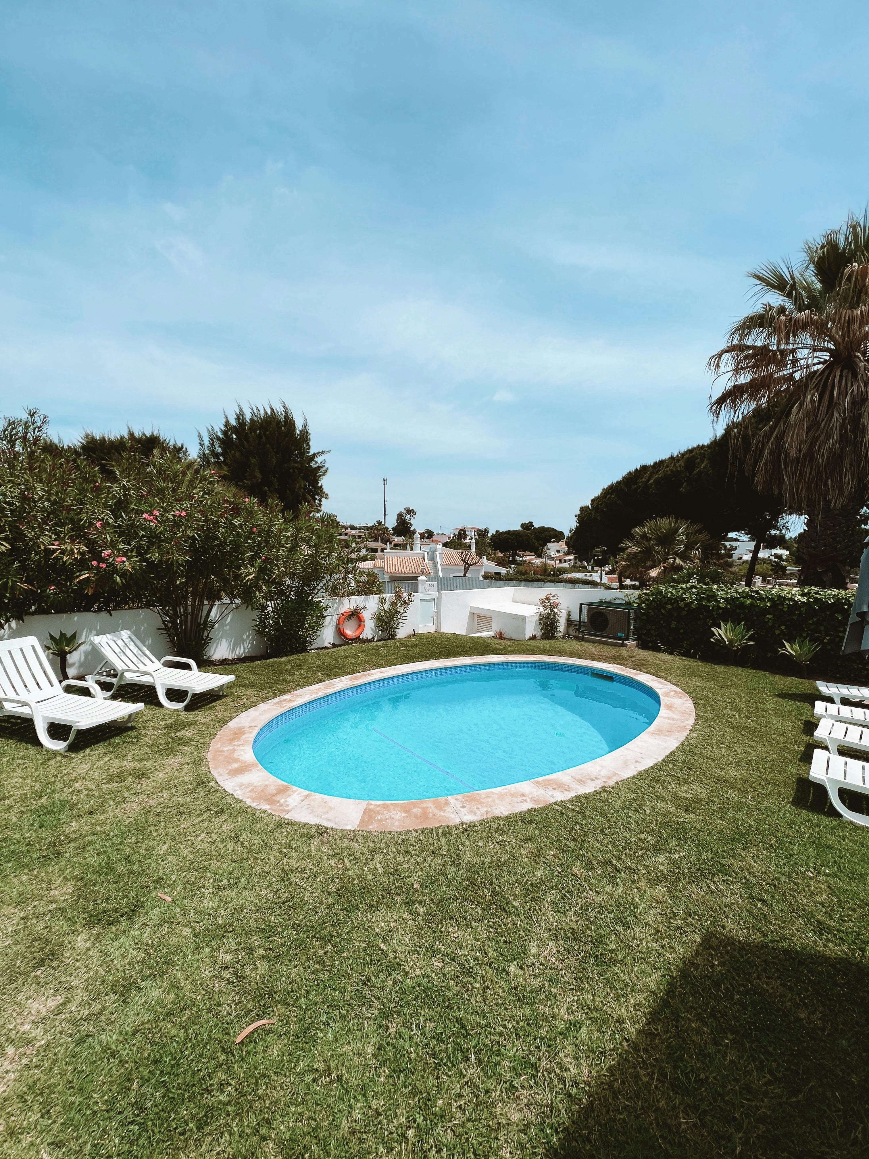 Swimming Pool on Grass Field under Blue Sky · Free Stock Photo