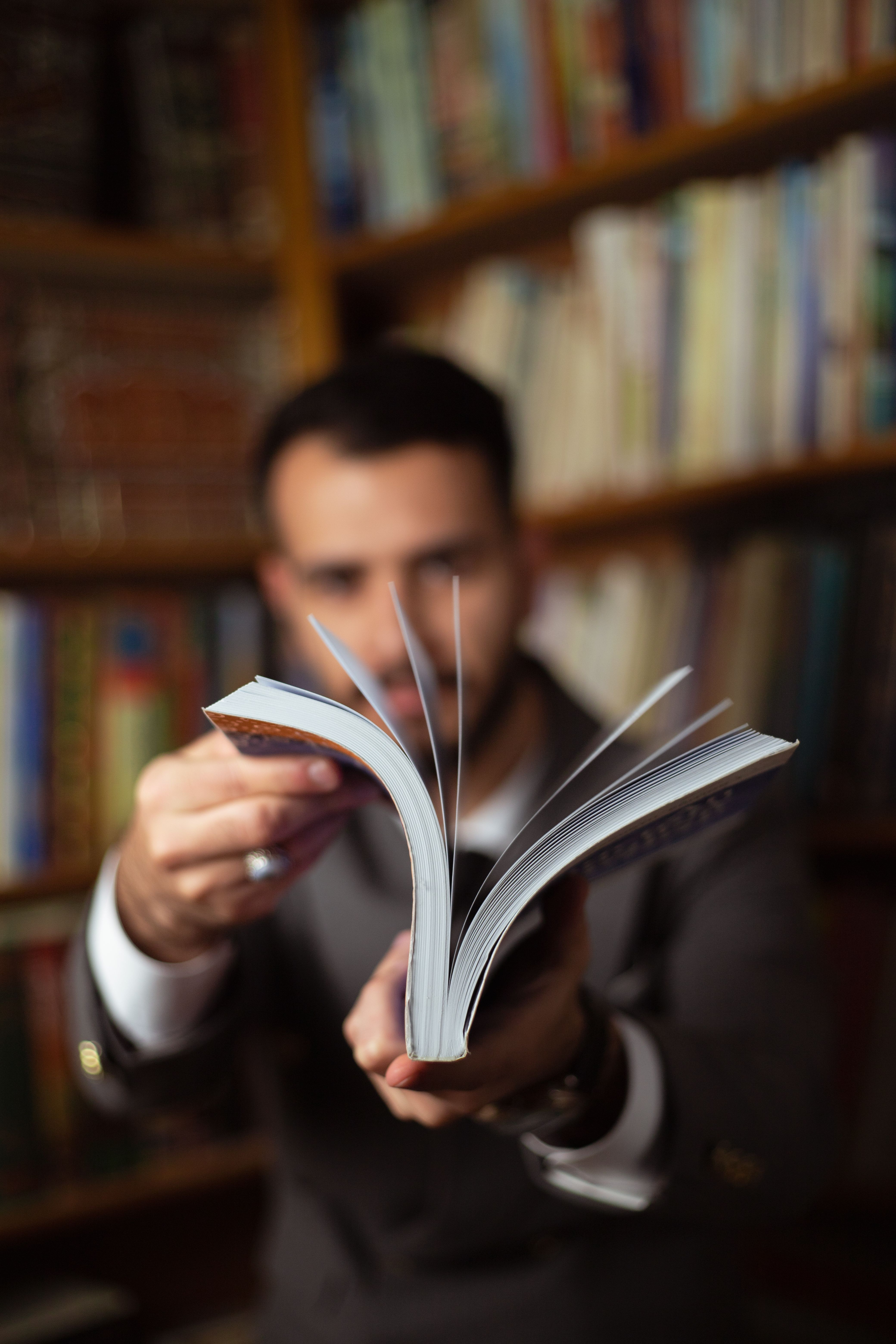 Selective Focus Photography of Standing Woman Flipping Pages of Book ...