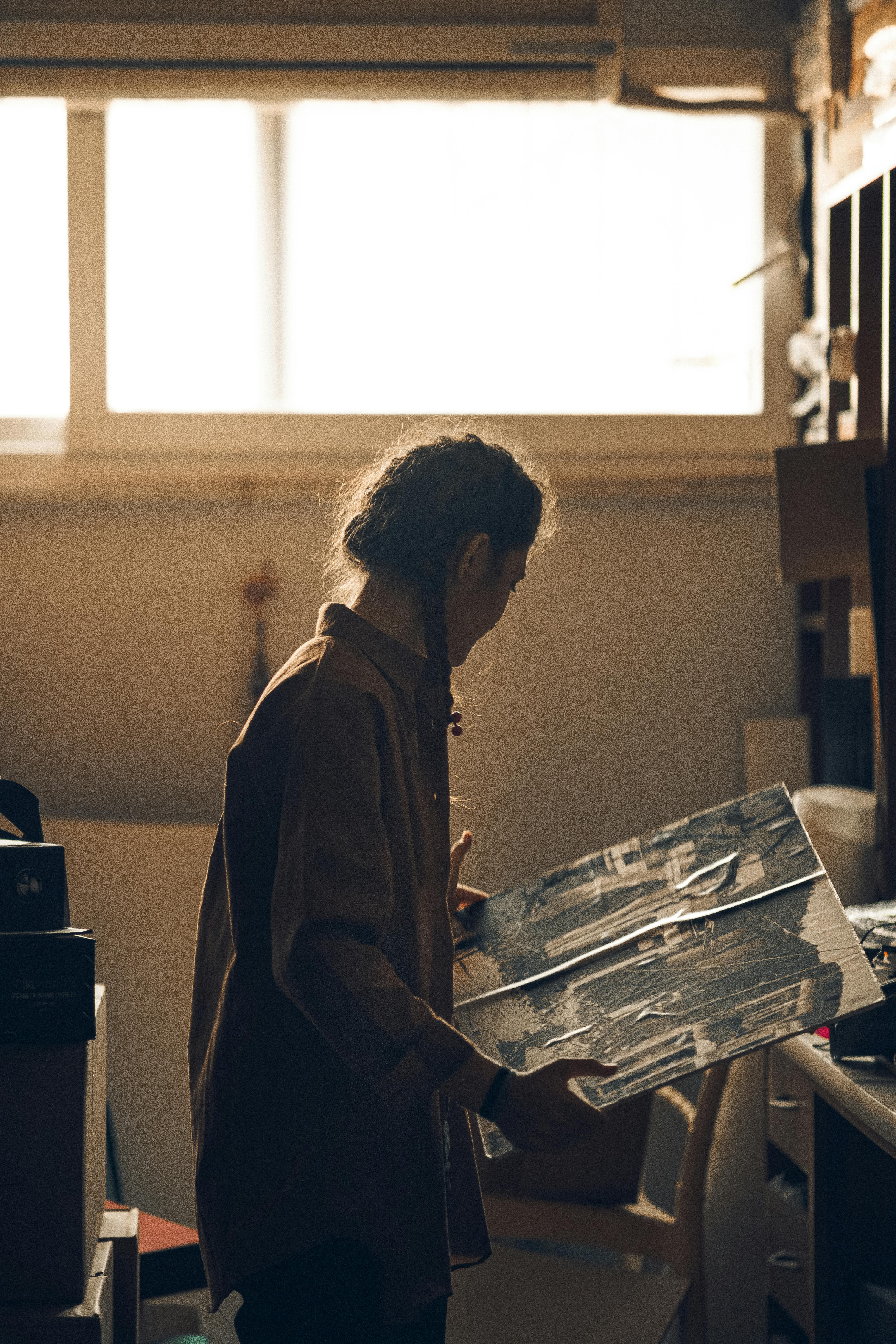 A Woman Looking a Painting · Free Stock Photo