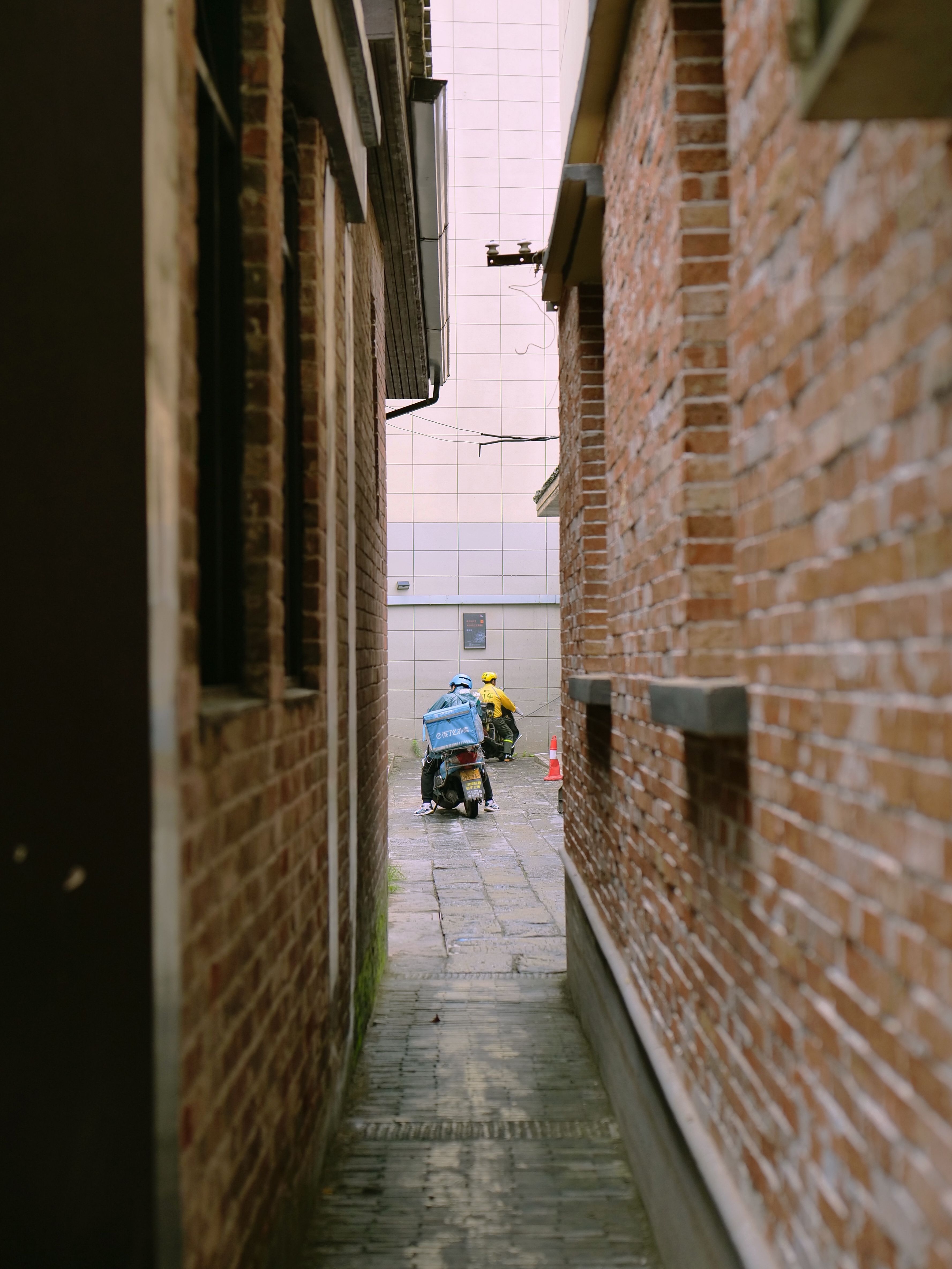 Person Sitting in Alley · Free Stock Photo