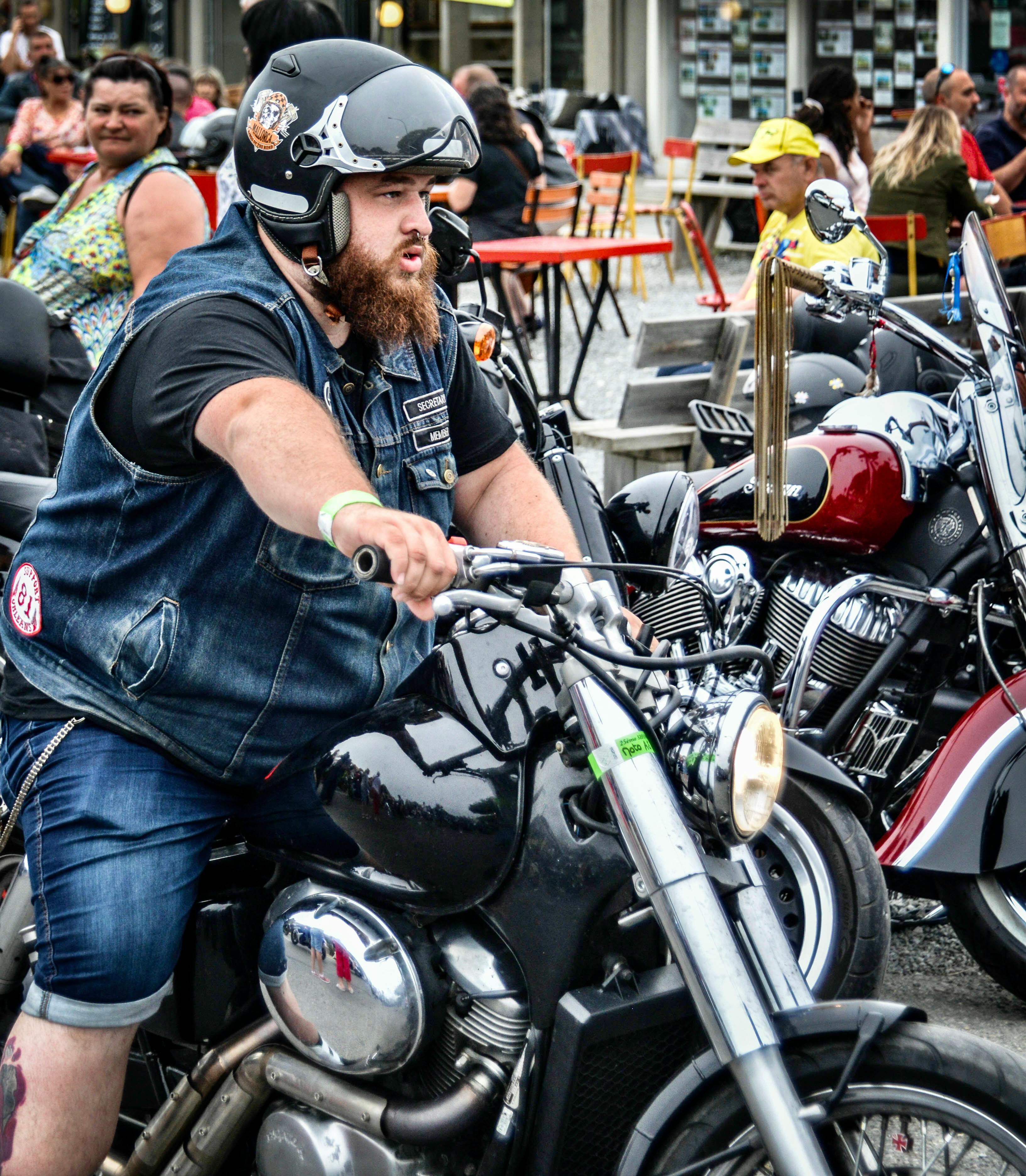 A Bearded Man Sitting on the Black Motorcycle · Free Stock Photo