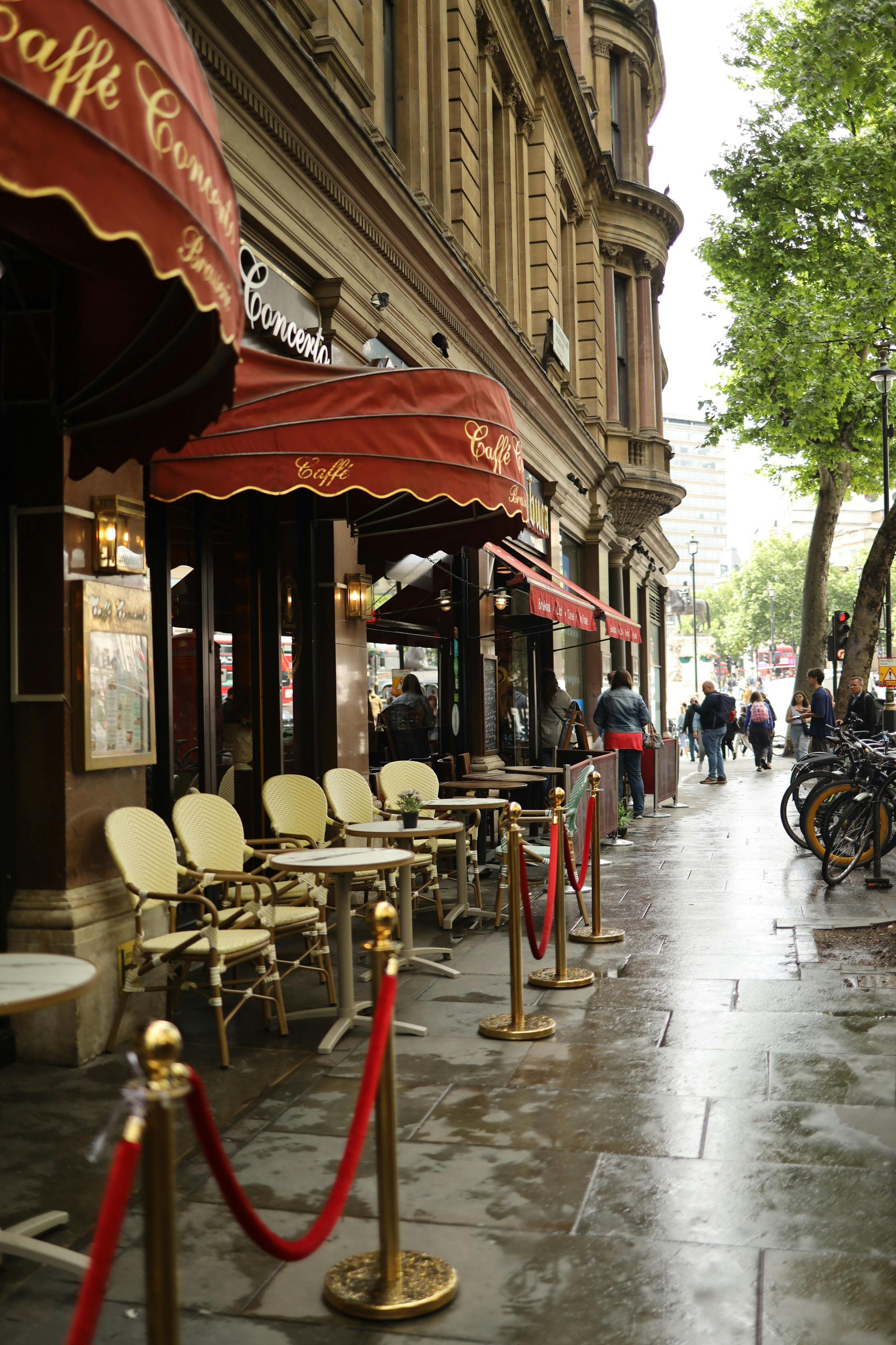 Cafe Tables on Street Pavement · Free Stock Photo