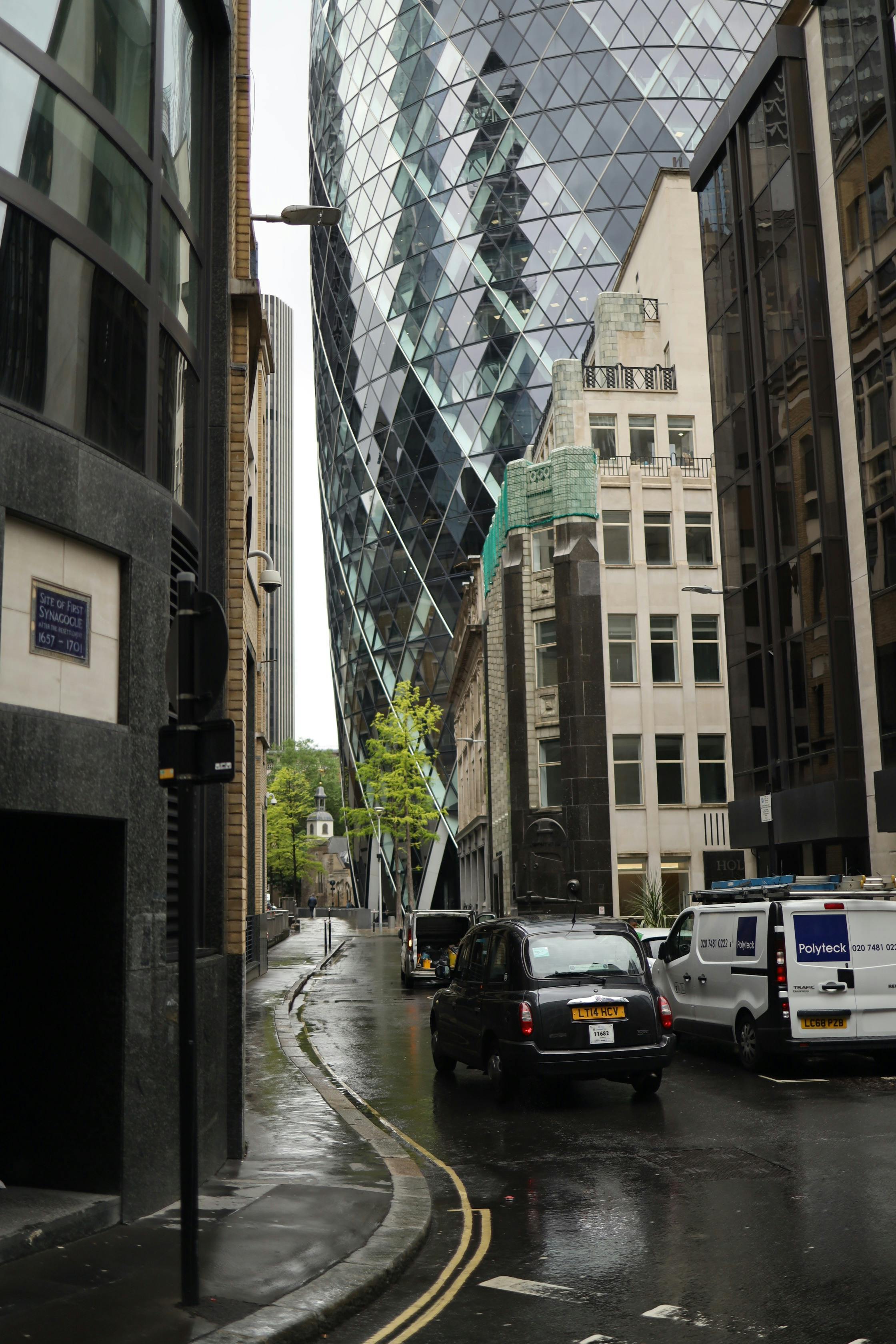 Cars Parked on Side of the Road in Between High Rise Buildings · Free ...