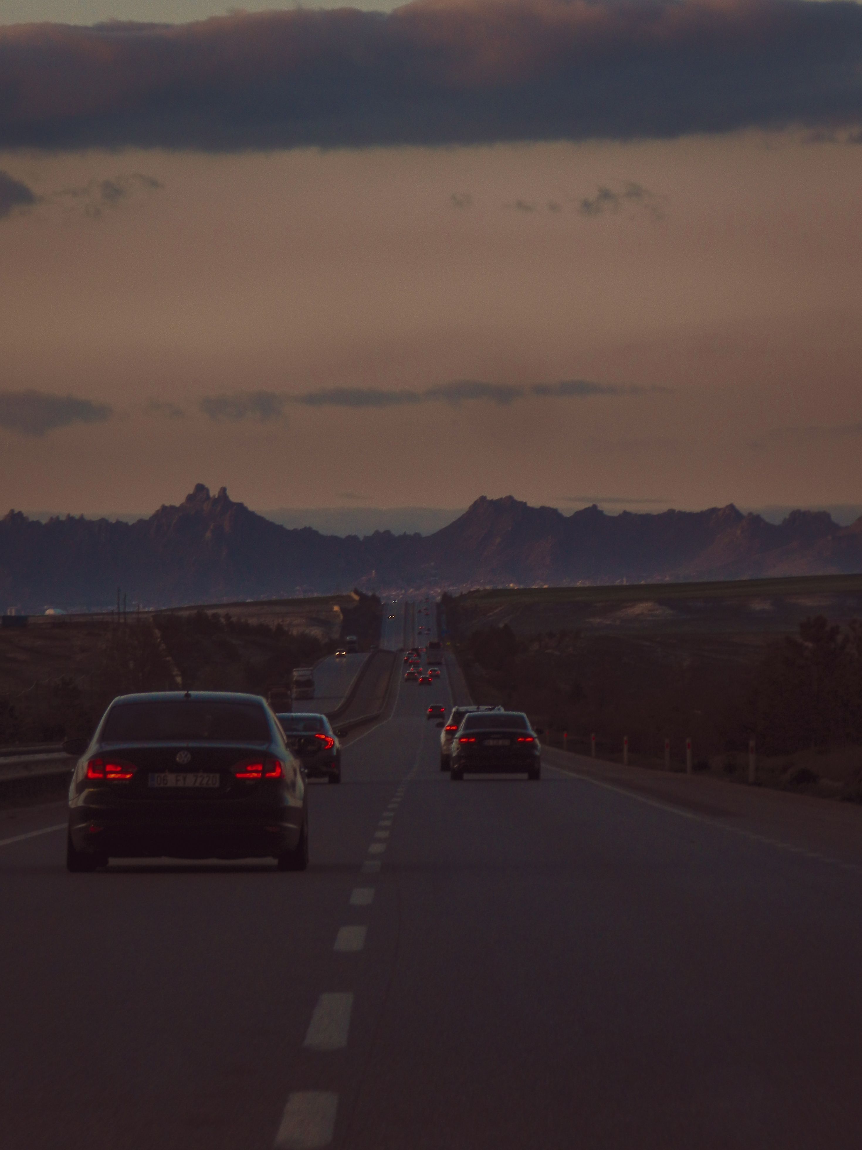 Cars Driving Countryside Road on Sunset · Free Stock Photo