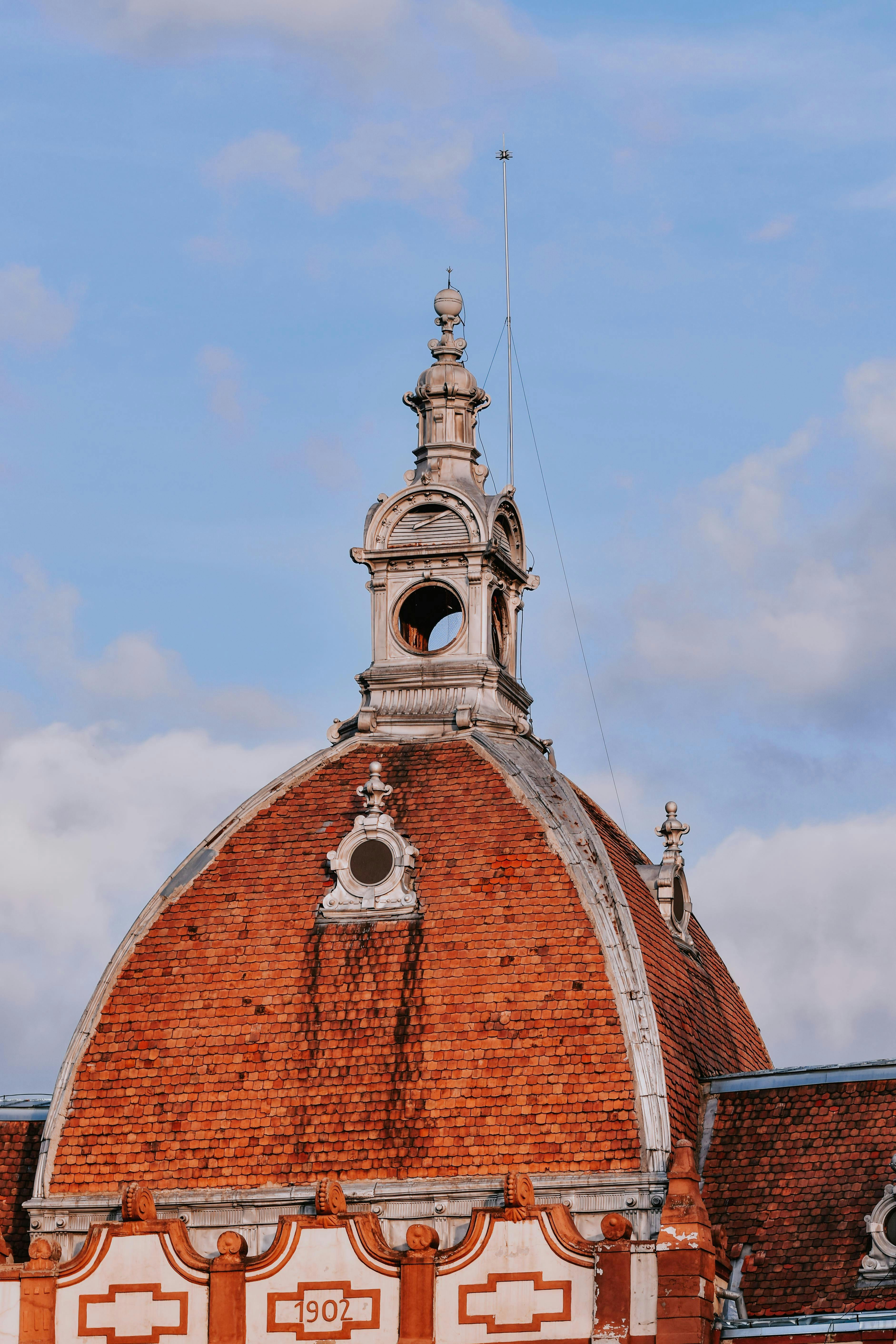 Red Brick Dome with a Grey Tower · Free Stock Photo