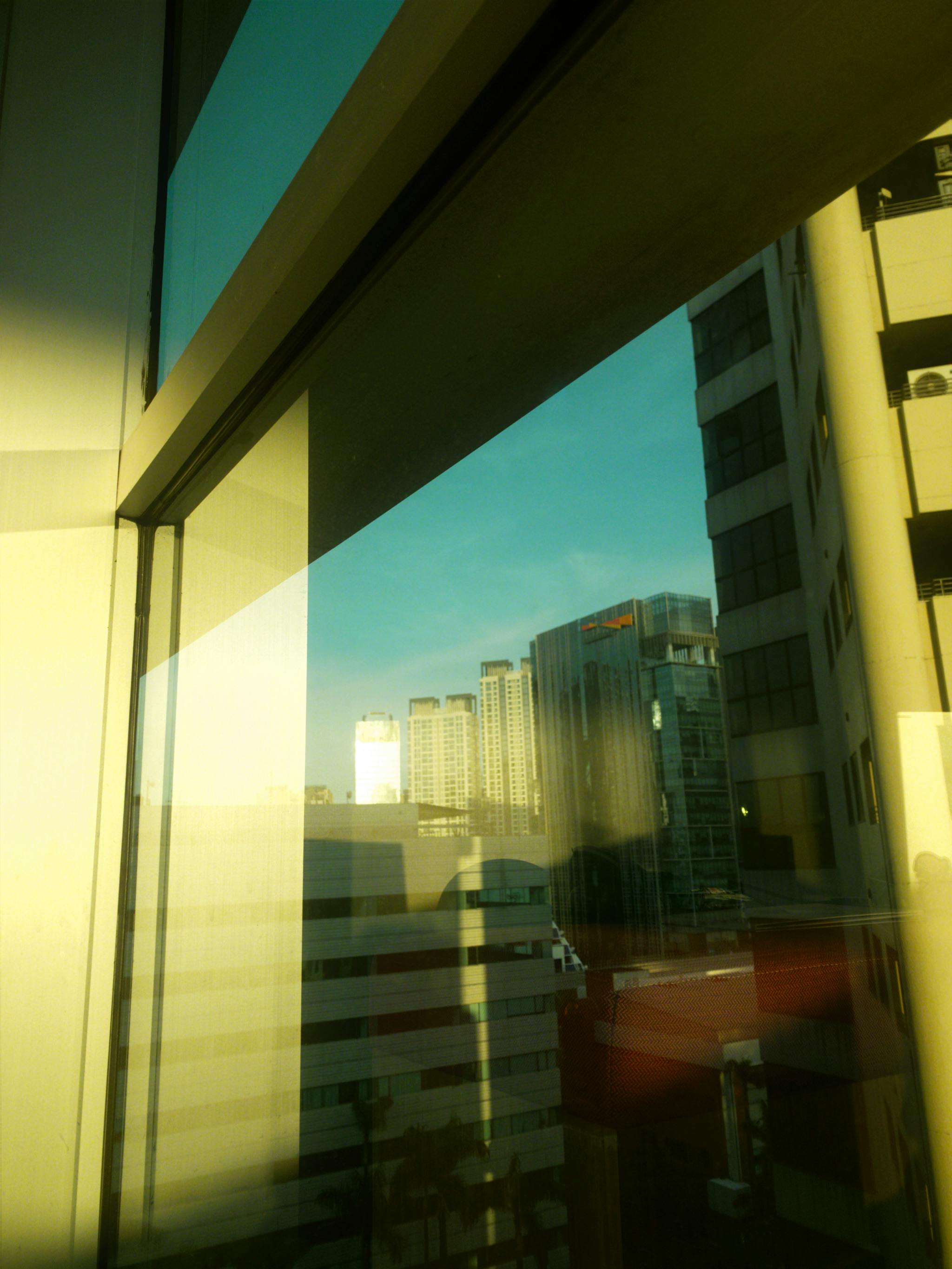 City Skyscrapers Reflection in Window · Free Stock Photo