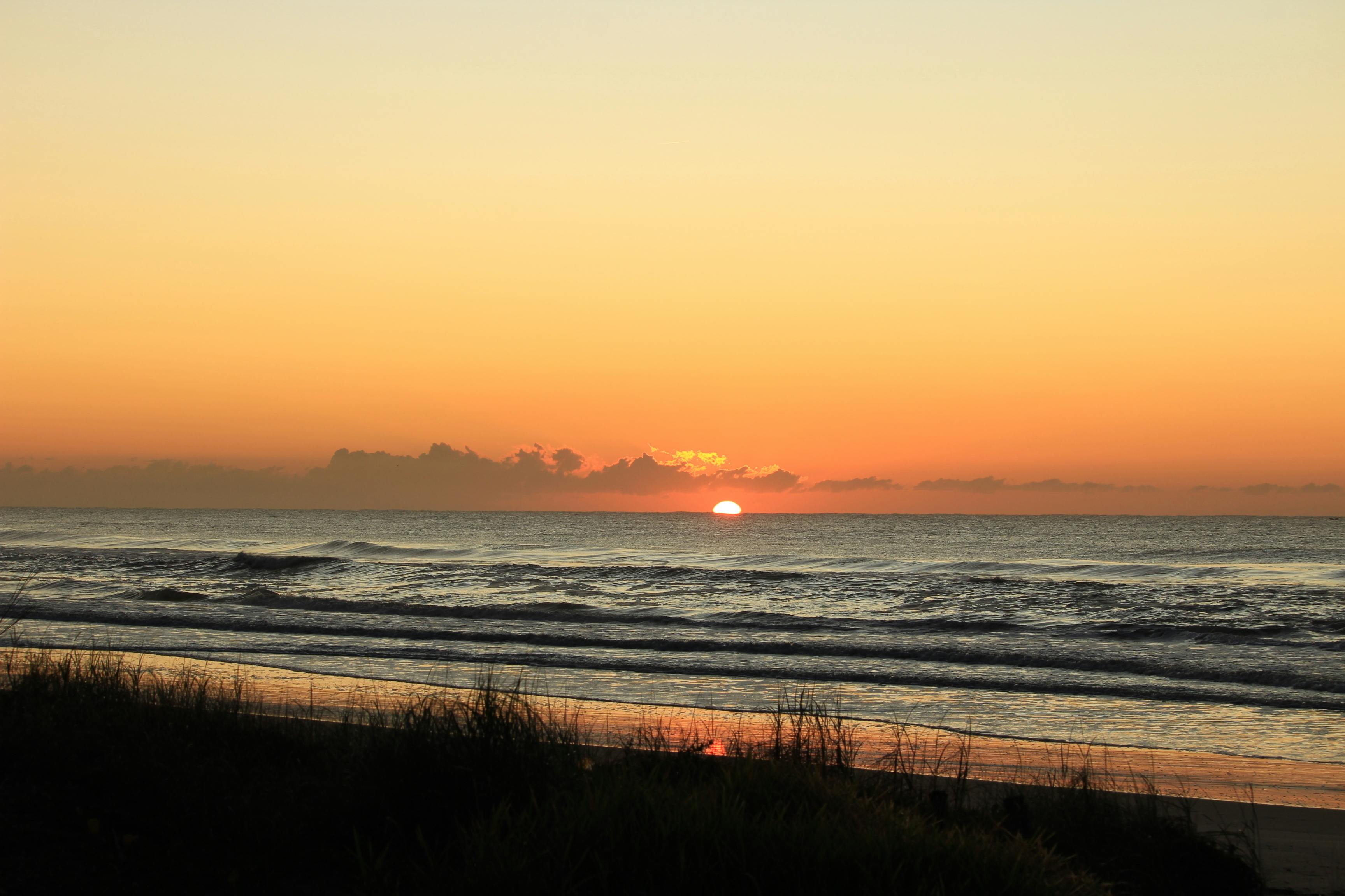 View of a Sunset over a Sea · Free Stock Photo