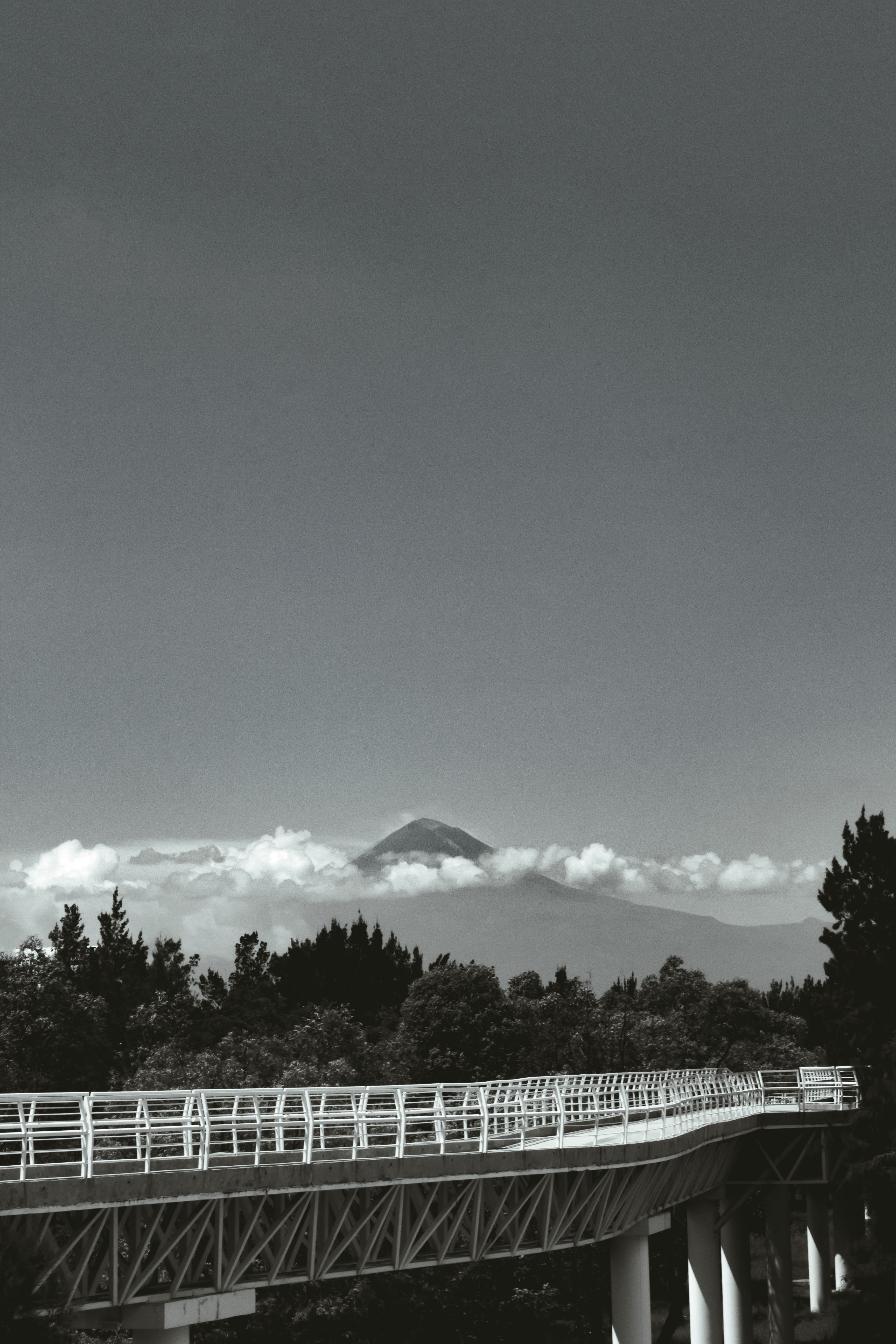 A White Bridge Near Mountain · Free Stock Photo