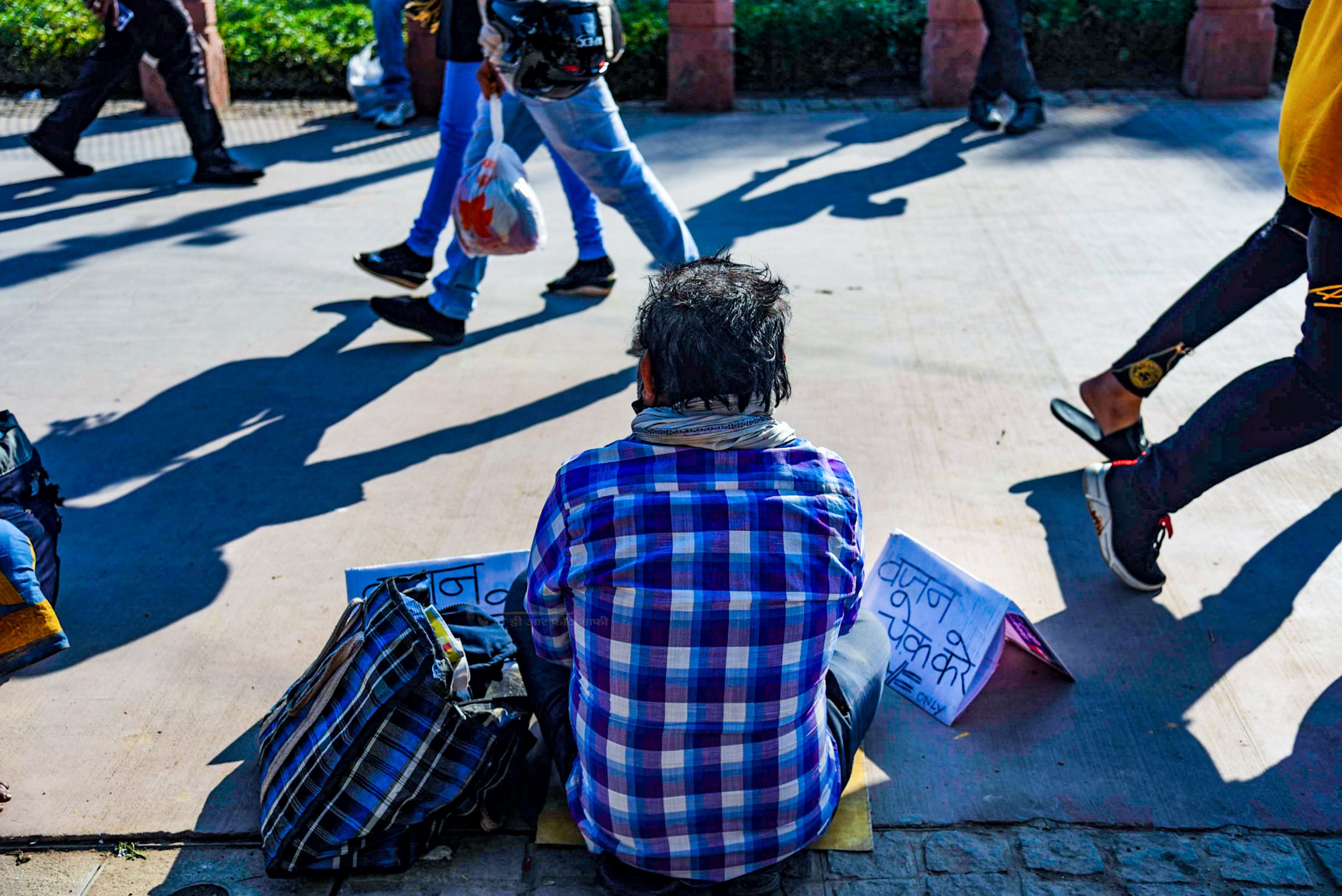 Homeless Man with Bag Walking on Street · Free Stock Photo