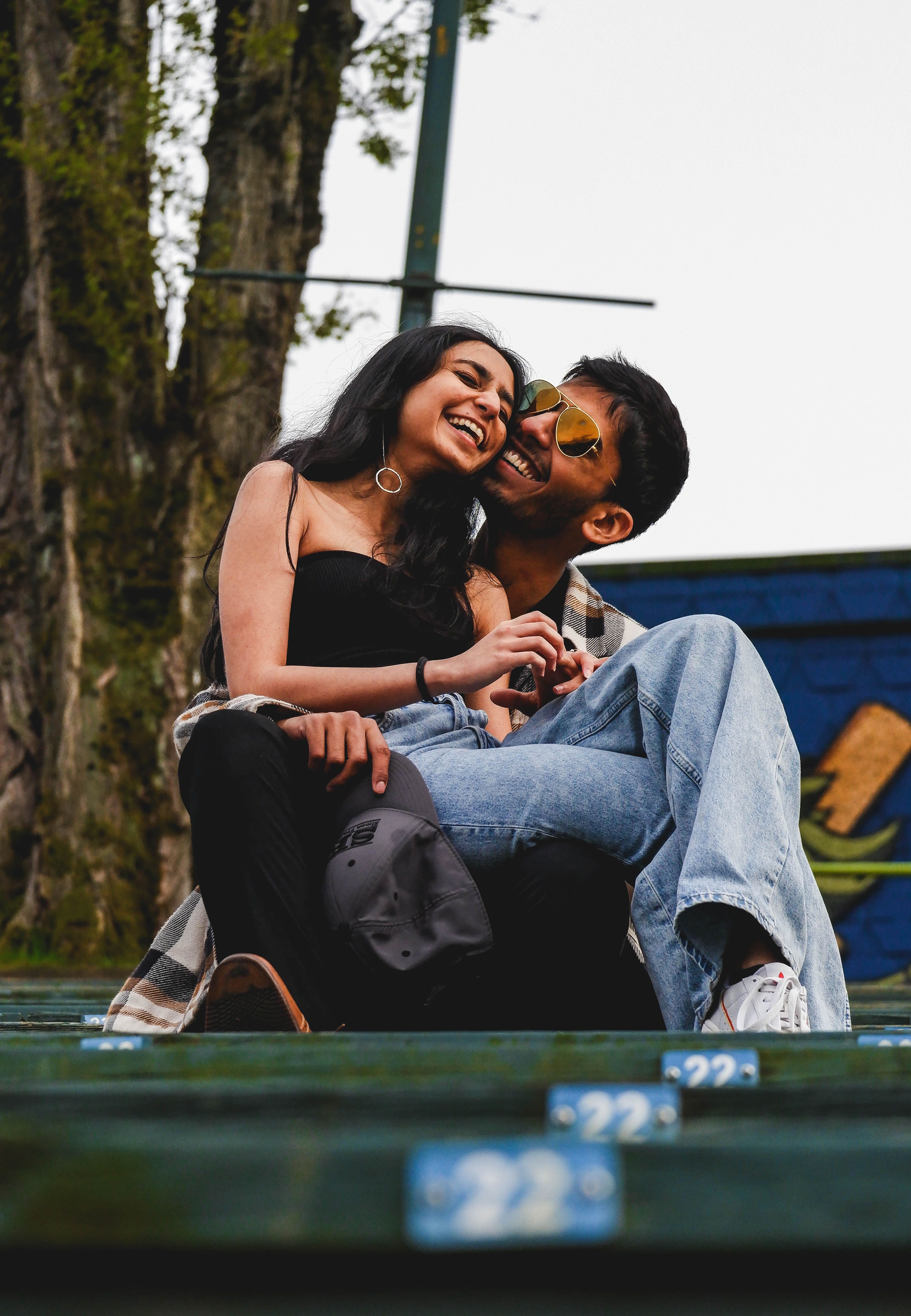 Low Angle Shot of a Happy Couple · Free Stock Photo
