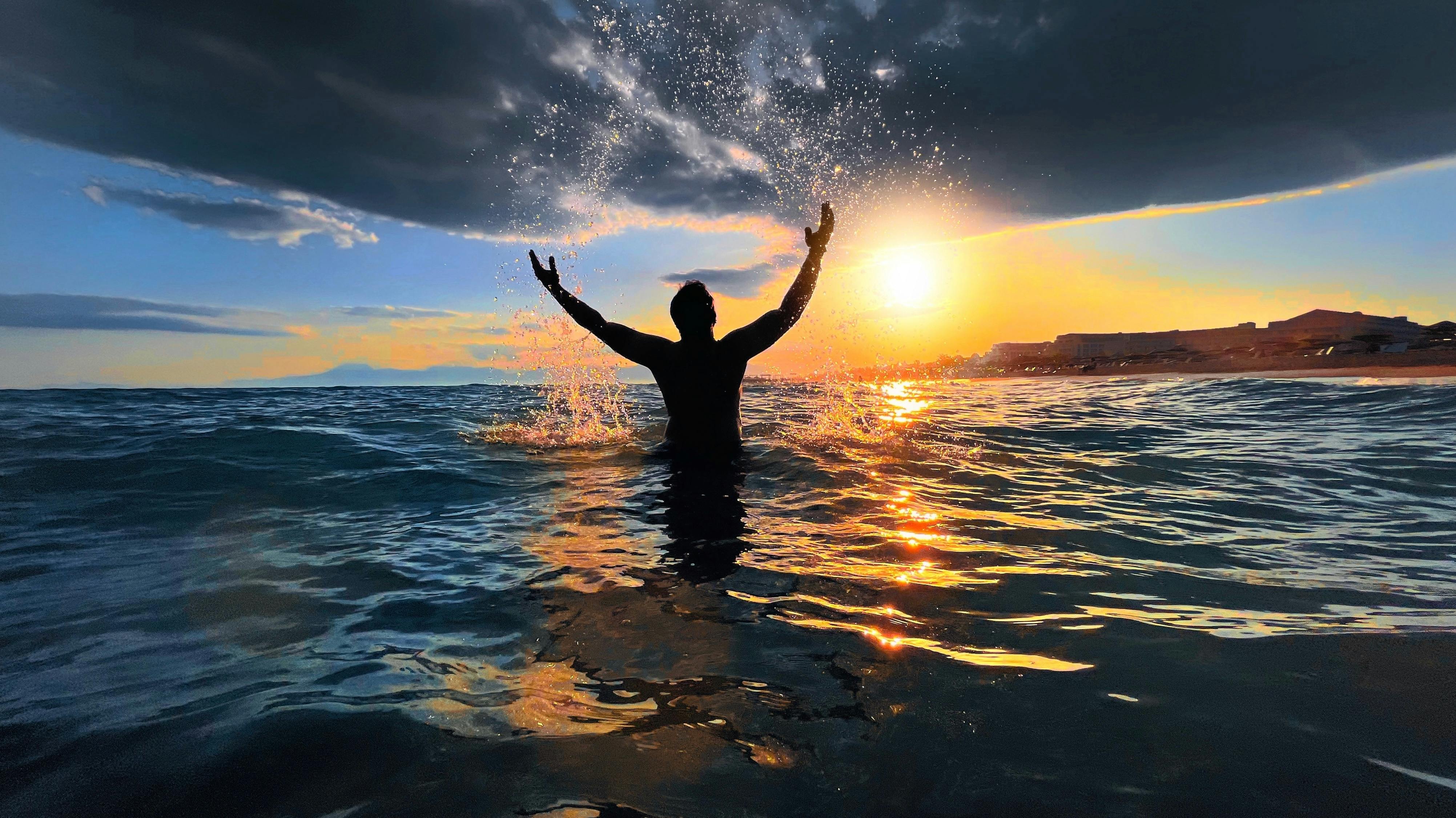 Man Splashing Sea Water · Free Stock Photo